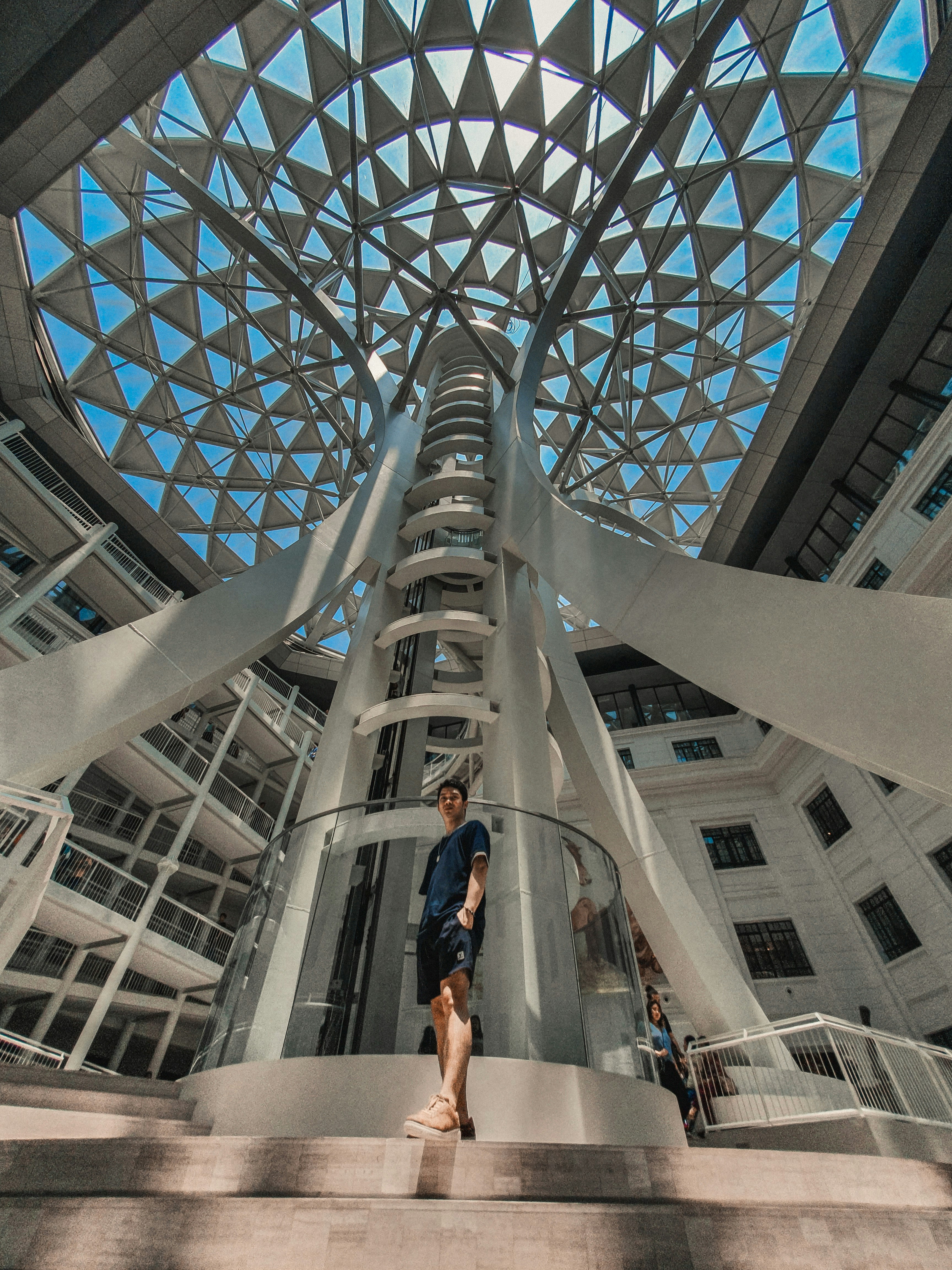 Ascendant Steel: A Traveler Beneath Geometry of Glass