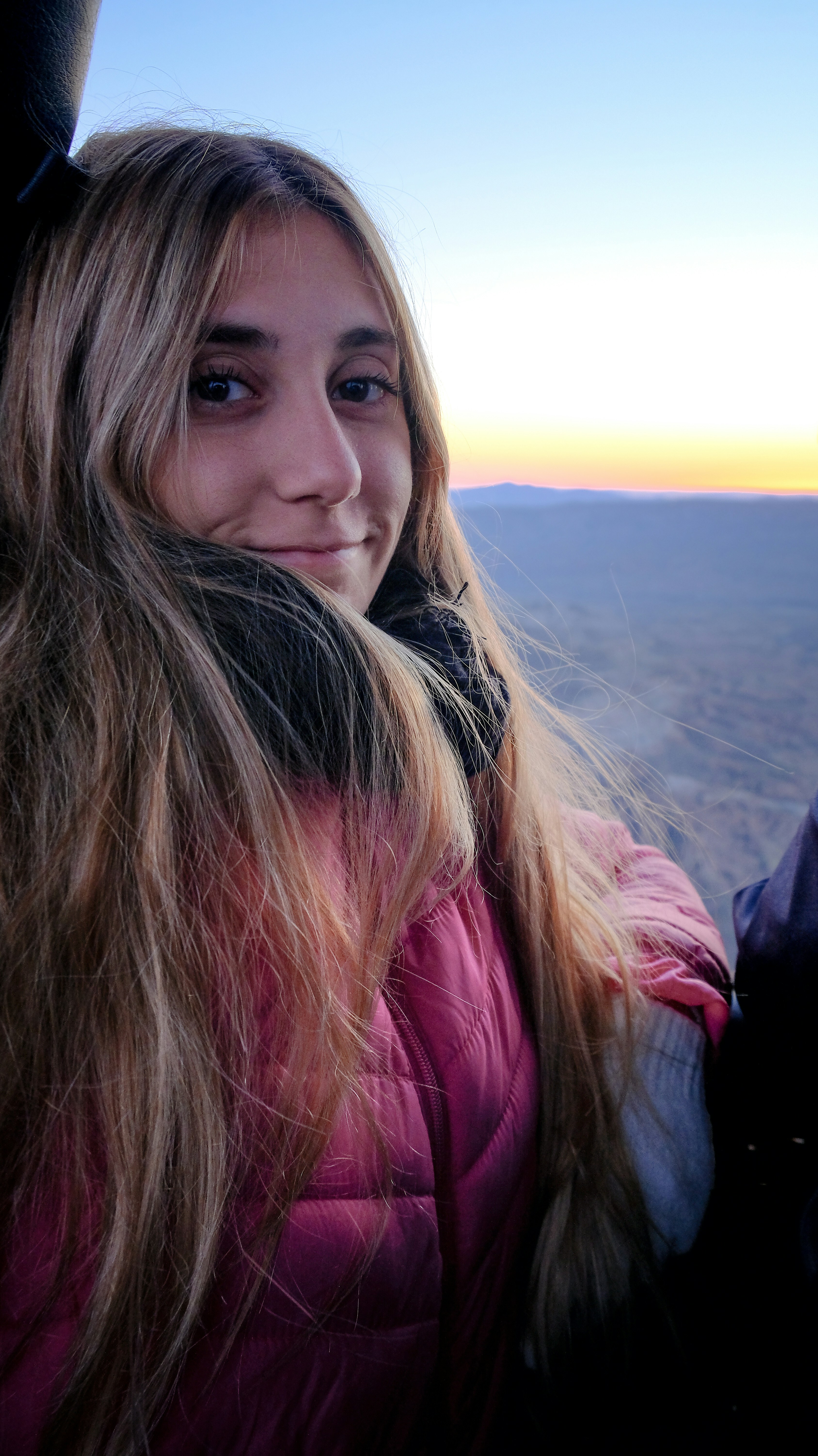 Balloon Horizon Portrait: Sunset Light Frames a Gentle Smile