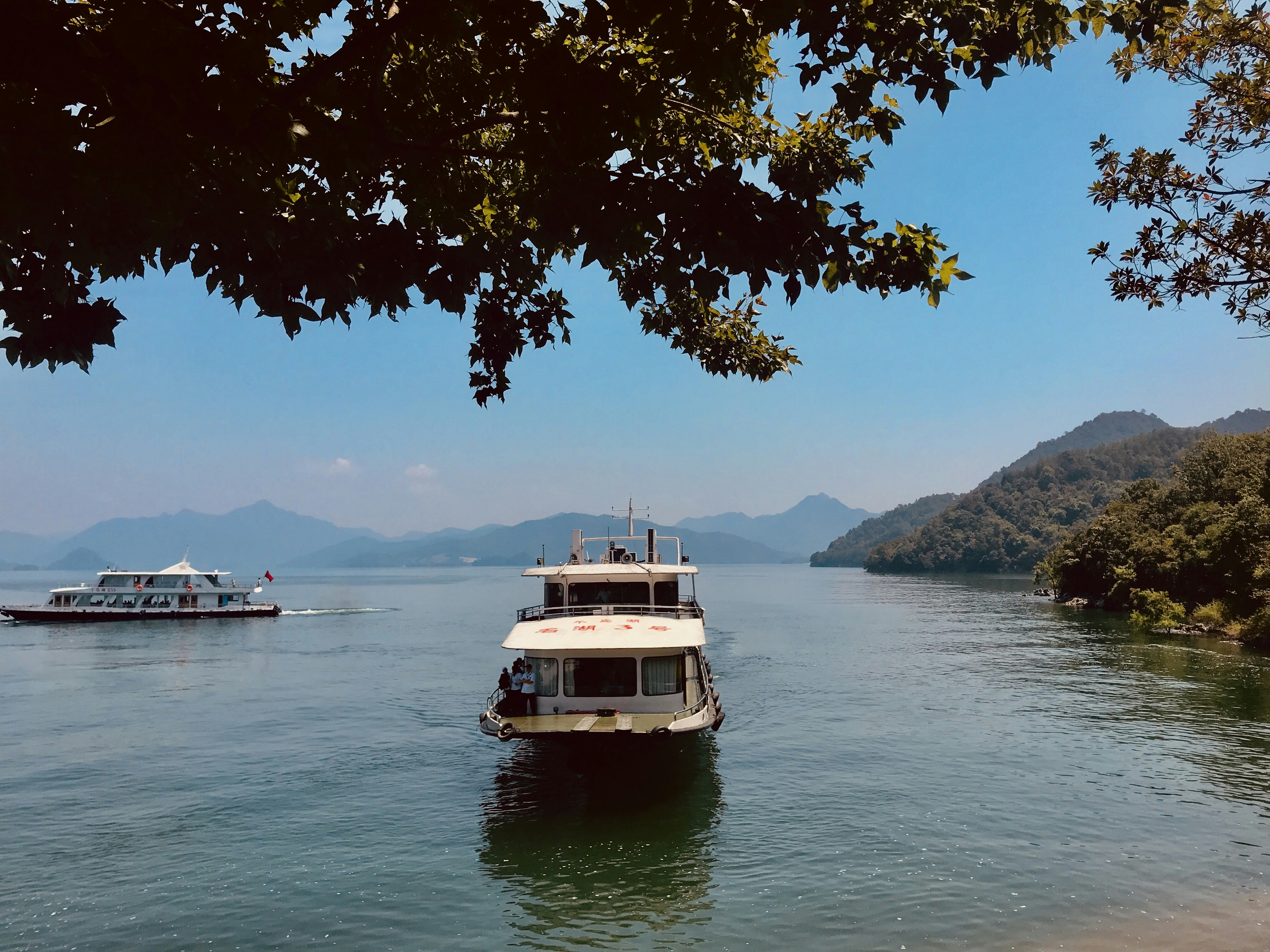 Serenity Afloat: Twin Vessels on Tranquil Waters
