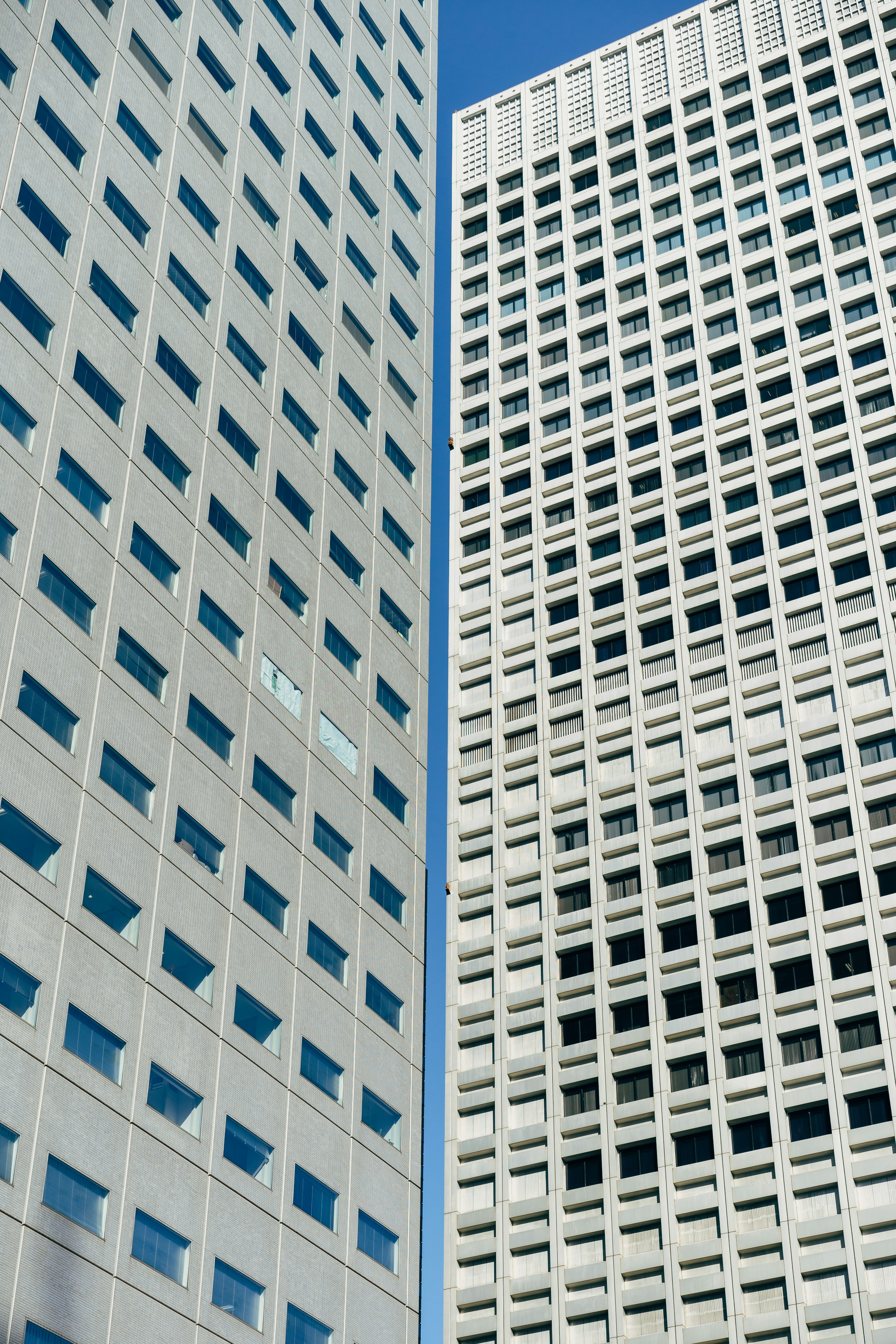 Two white high-rise buildings photo – Free Blue Image on Unsplash