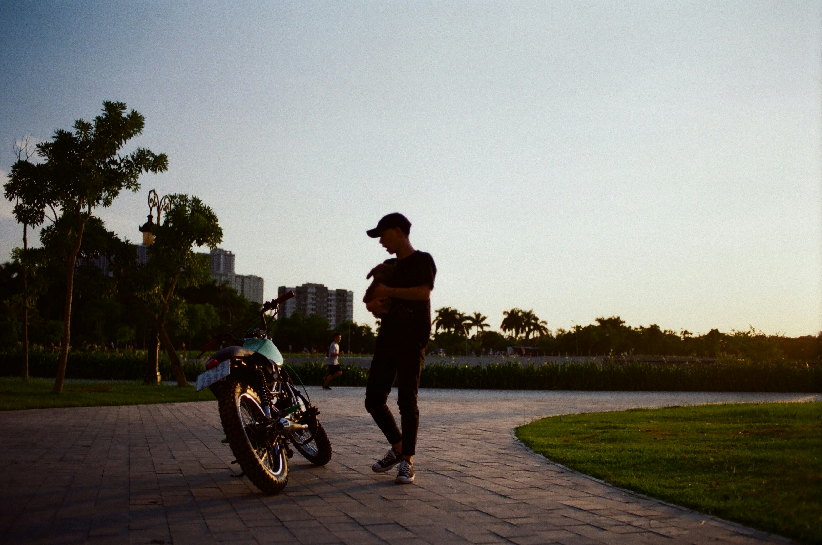 Man standing beside motorcycle photo – Free Hanoi Image on Unsplash