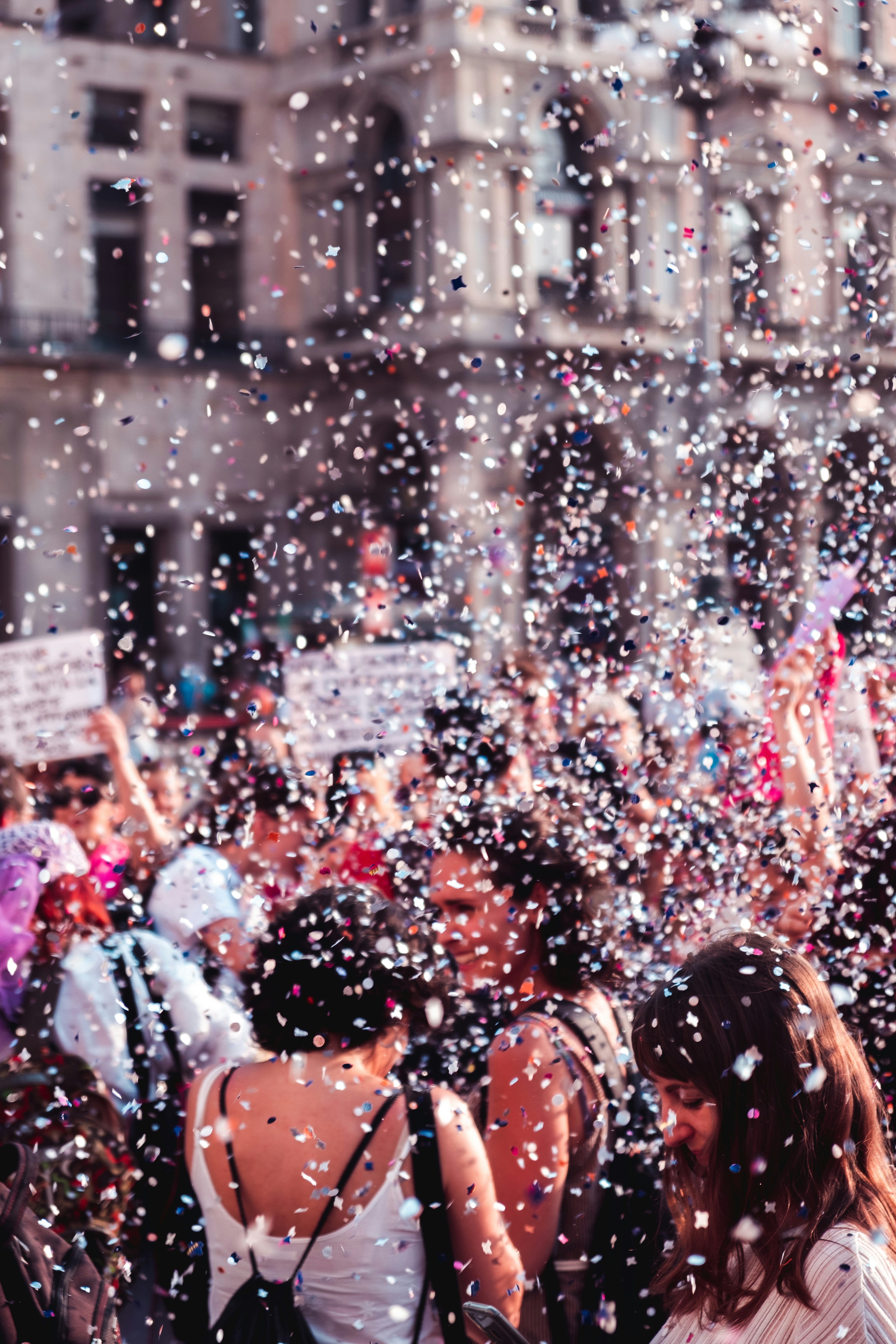 Confetti Cascade Over a Crowded Street CelebrationBechir Kaddech