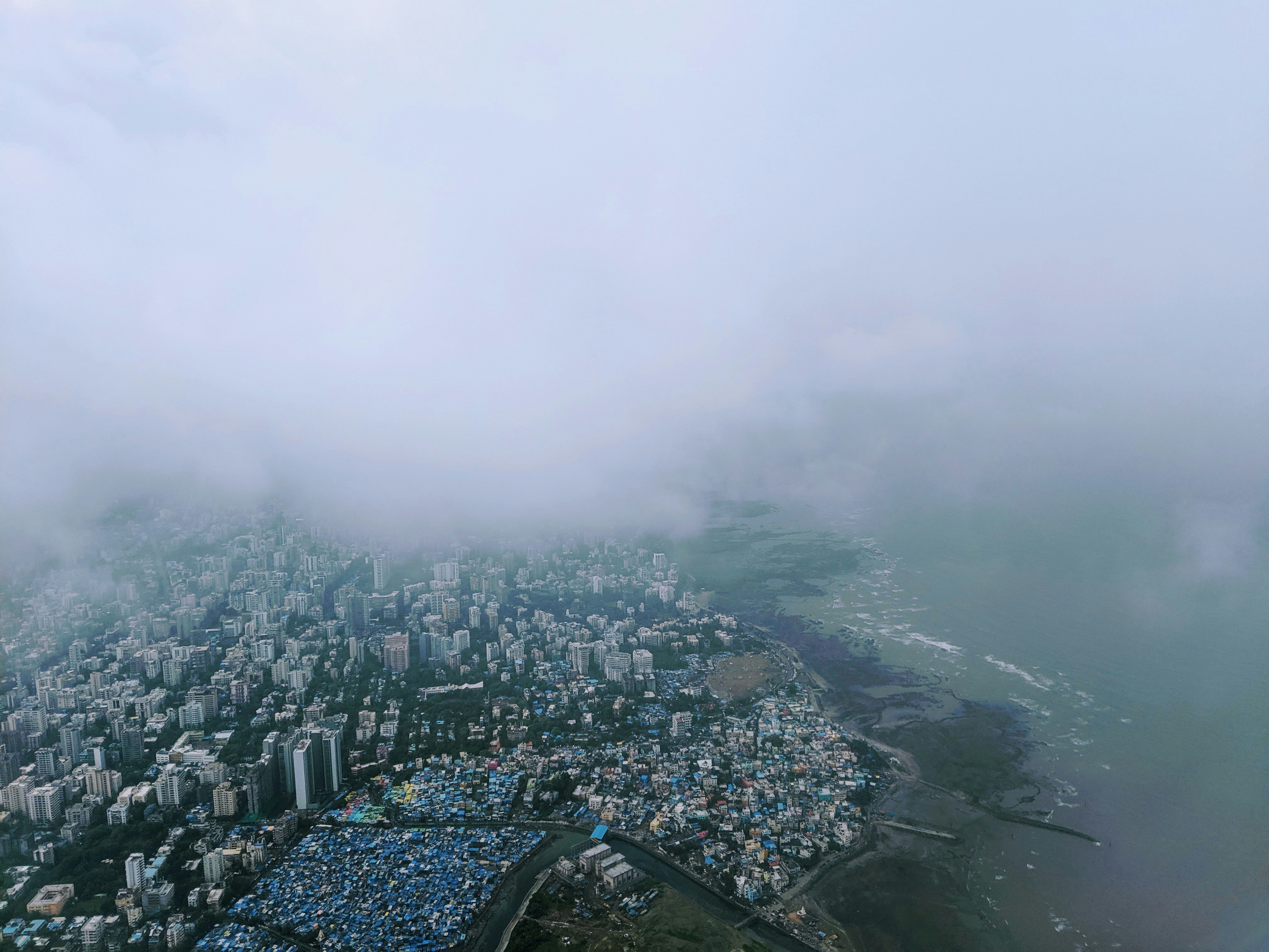 Cloud-Kissed Urban CoastlineBharath Reddy