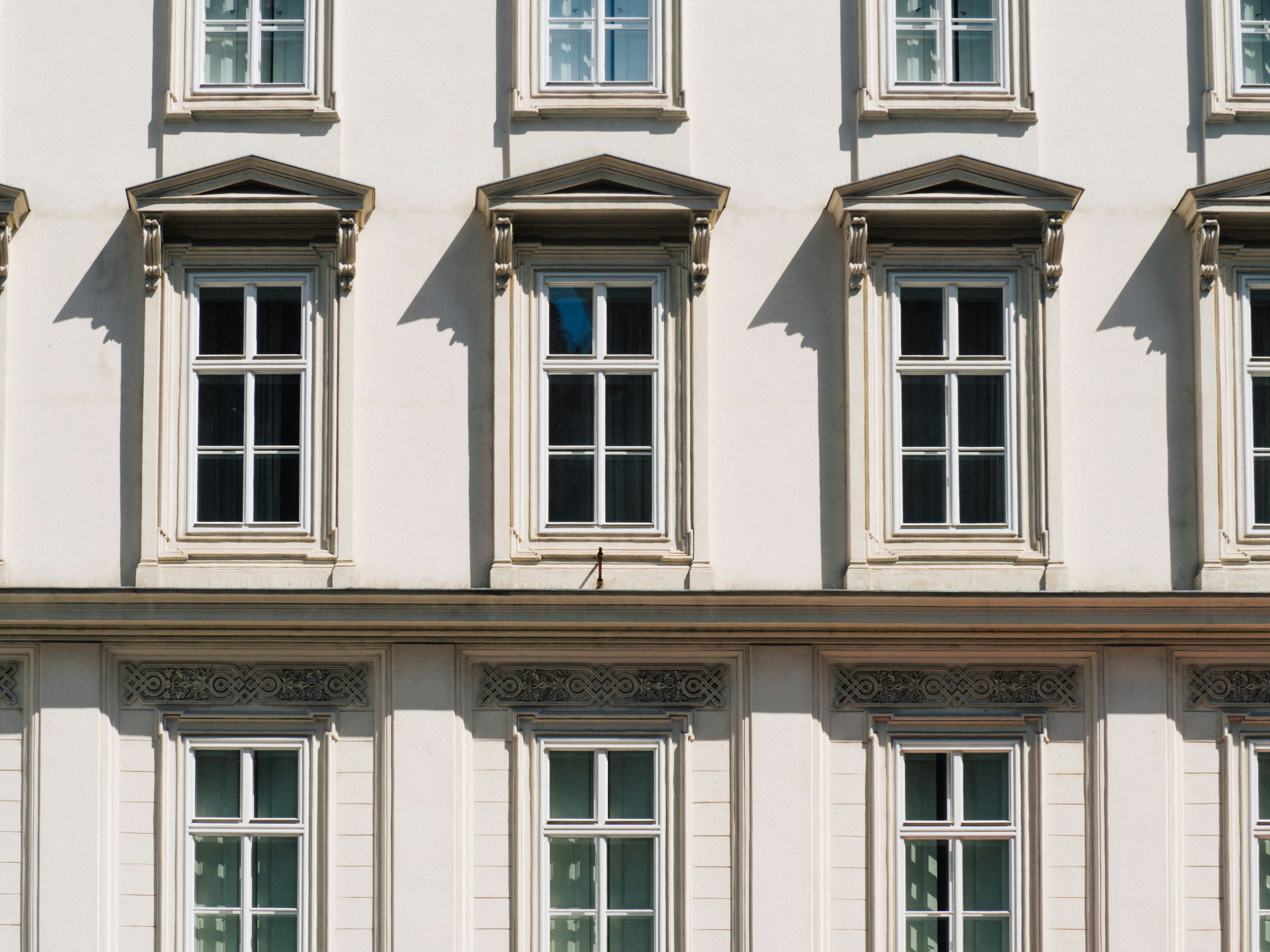 White cement building with rows of windows photo – Free Vienna Image on ...