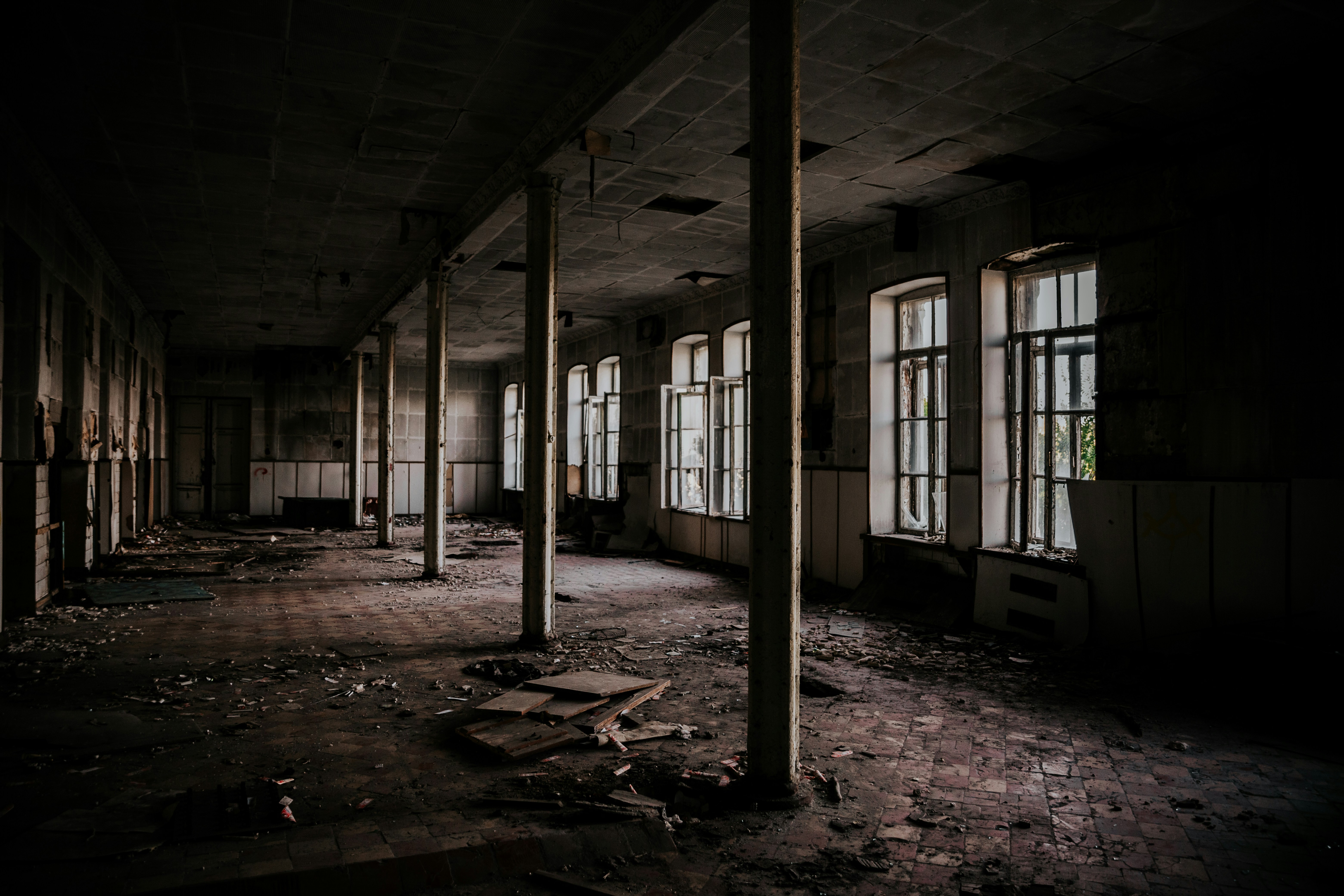 A run down building with lots of windows photo – Free Building Image on ...