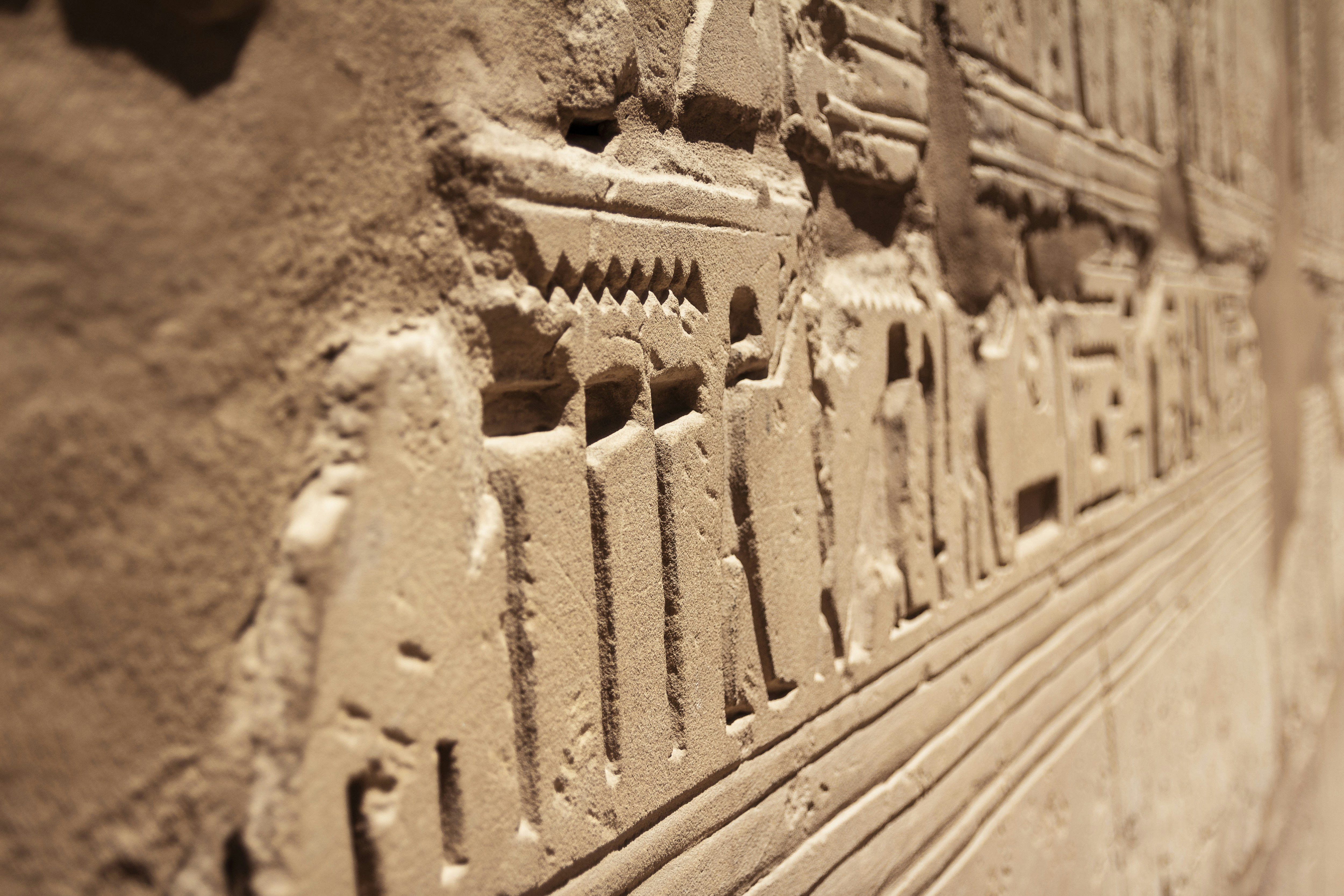 Sepia Frieze: Quiet Geometry Etched into an Ancient Wall