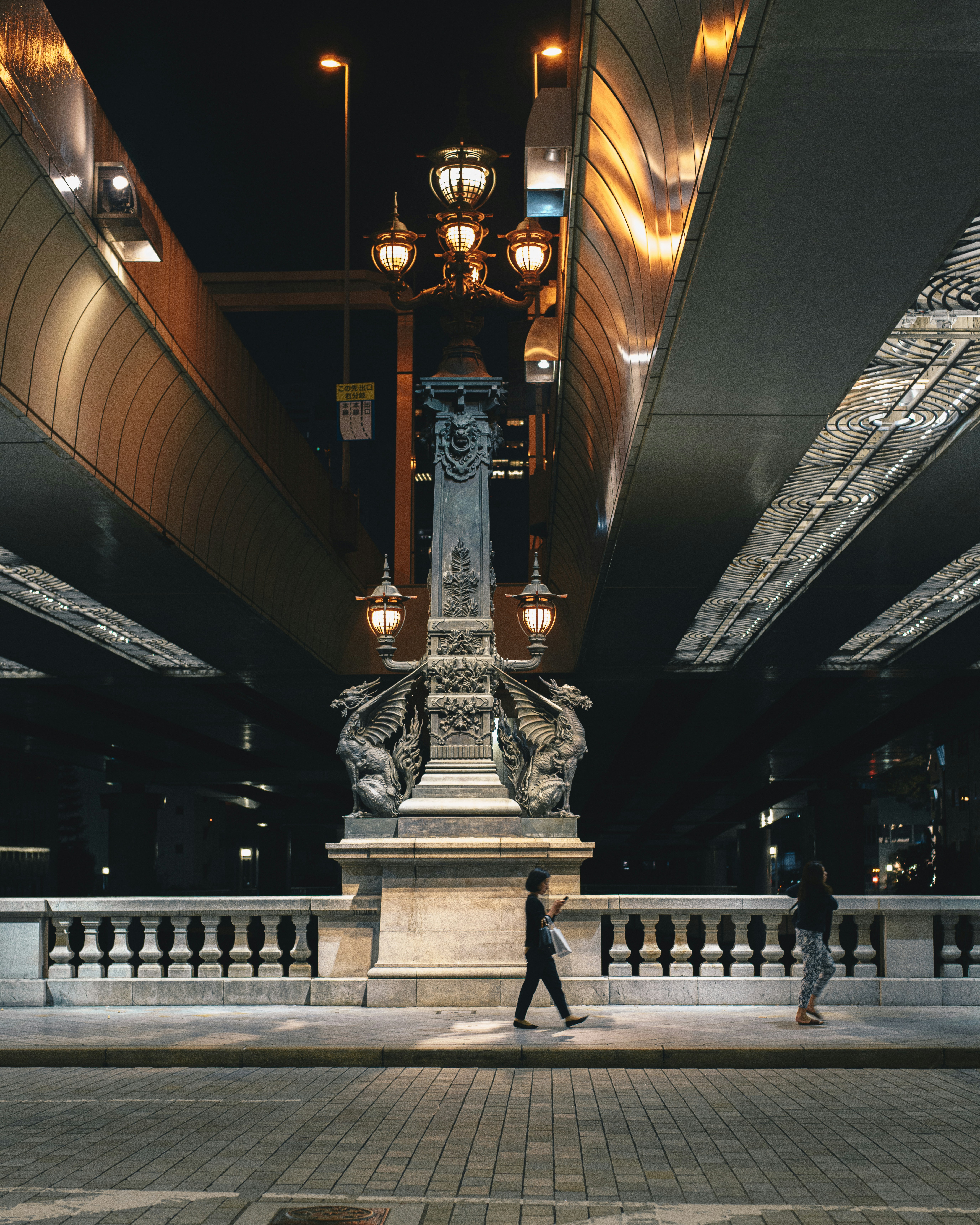 Obelisk sculpture under bridges photo – Free Human Image on Unsplash