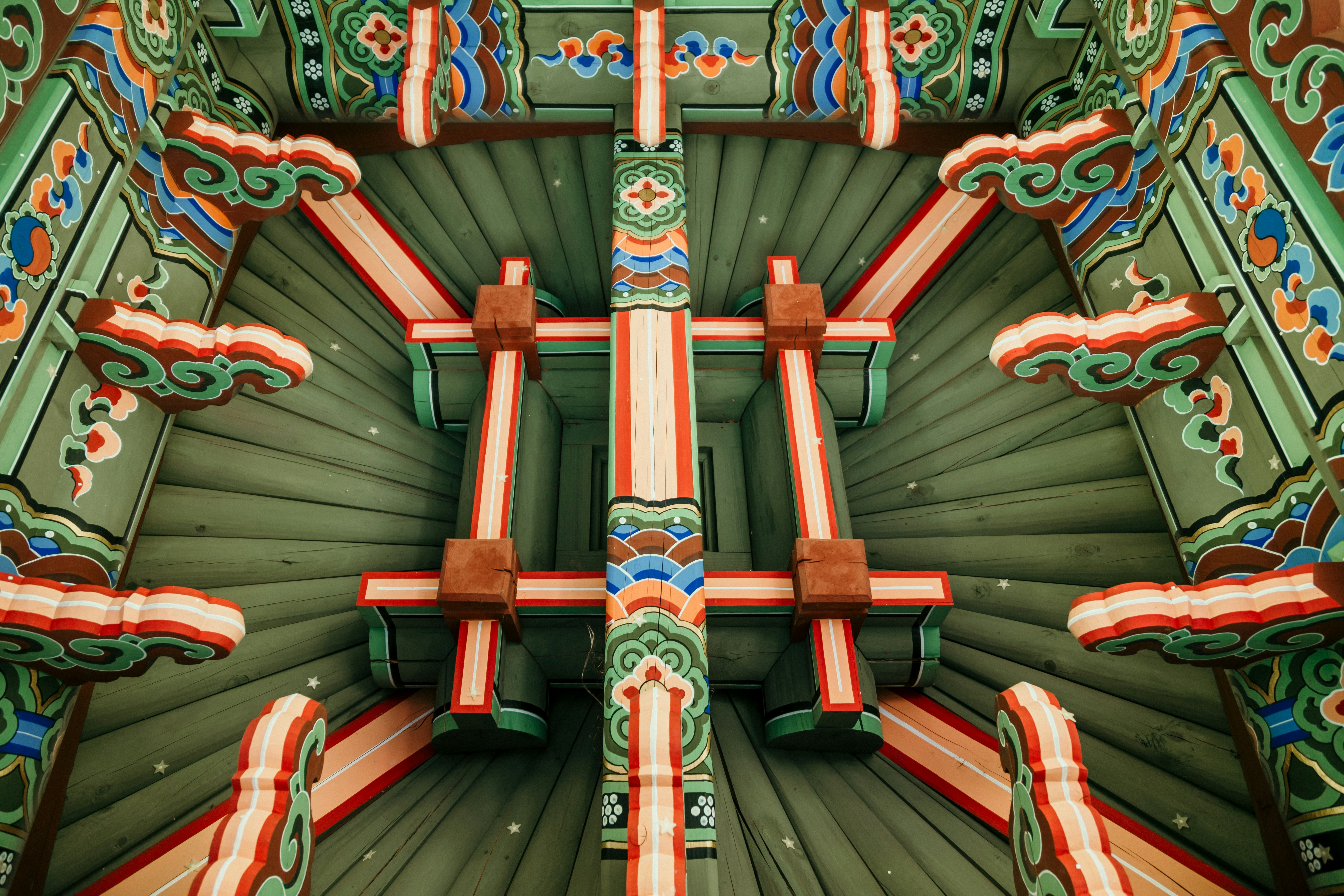 Dancheong Crosswork: Symmetrical Roof Beams in Cerulean and Vermilion