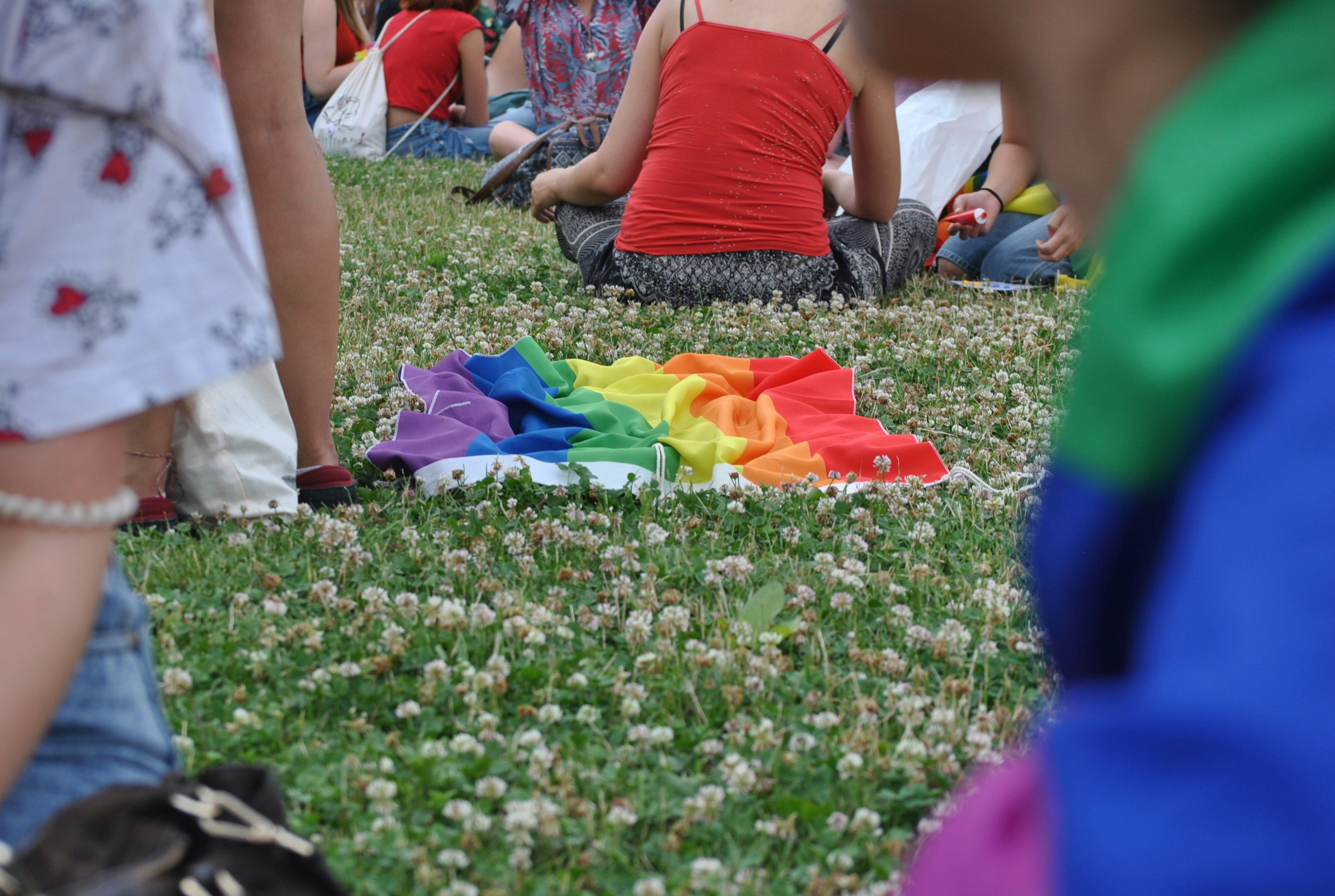 Rainbow on the Green: A Moment of Color Amid a Daytime Gathering
