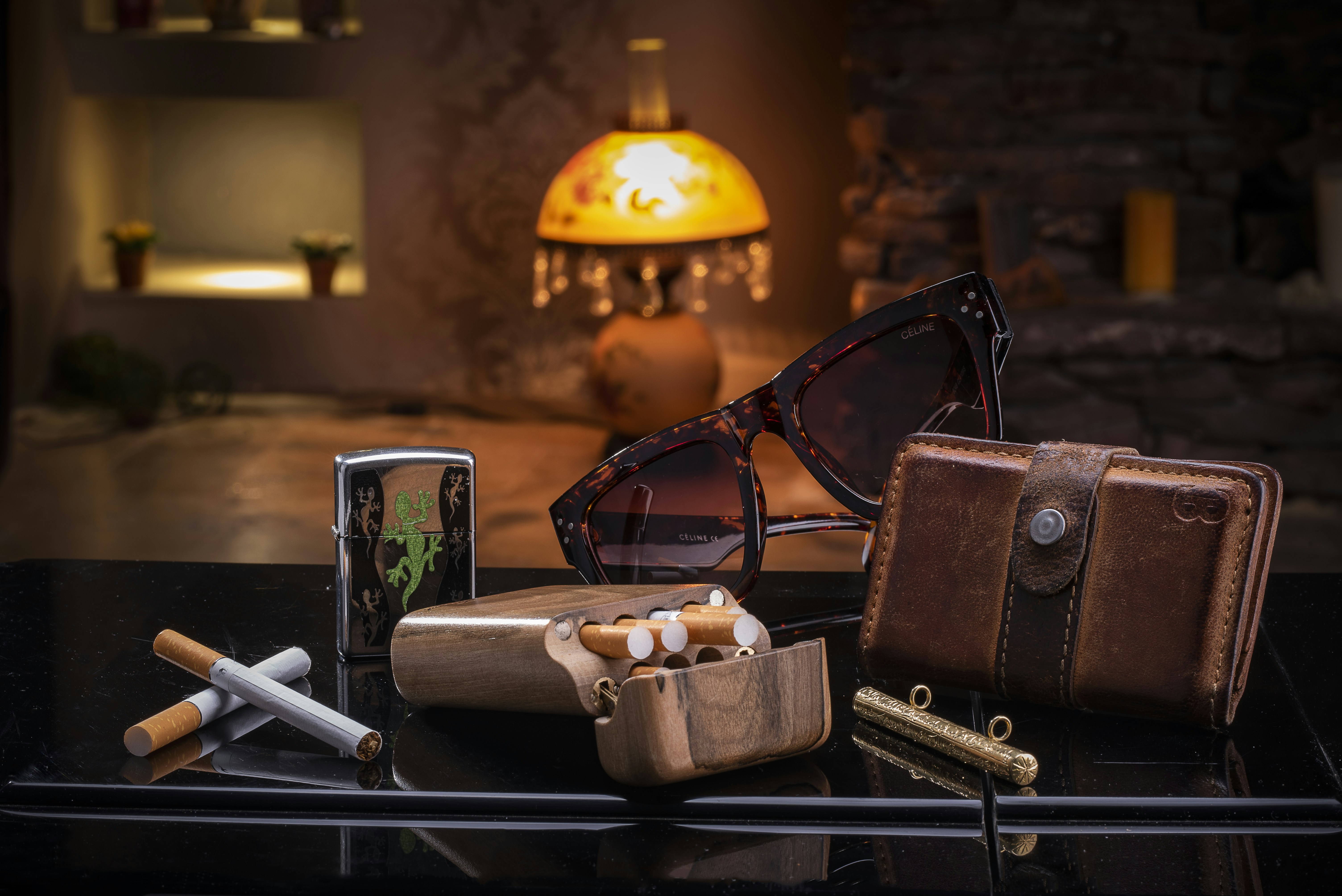 Midnight Still Life: Ashtray, Sunglasses, and Wallet on a Reflective Bar Surface