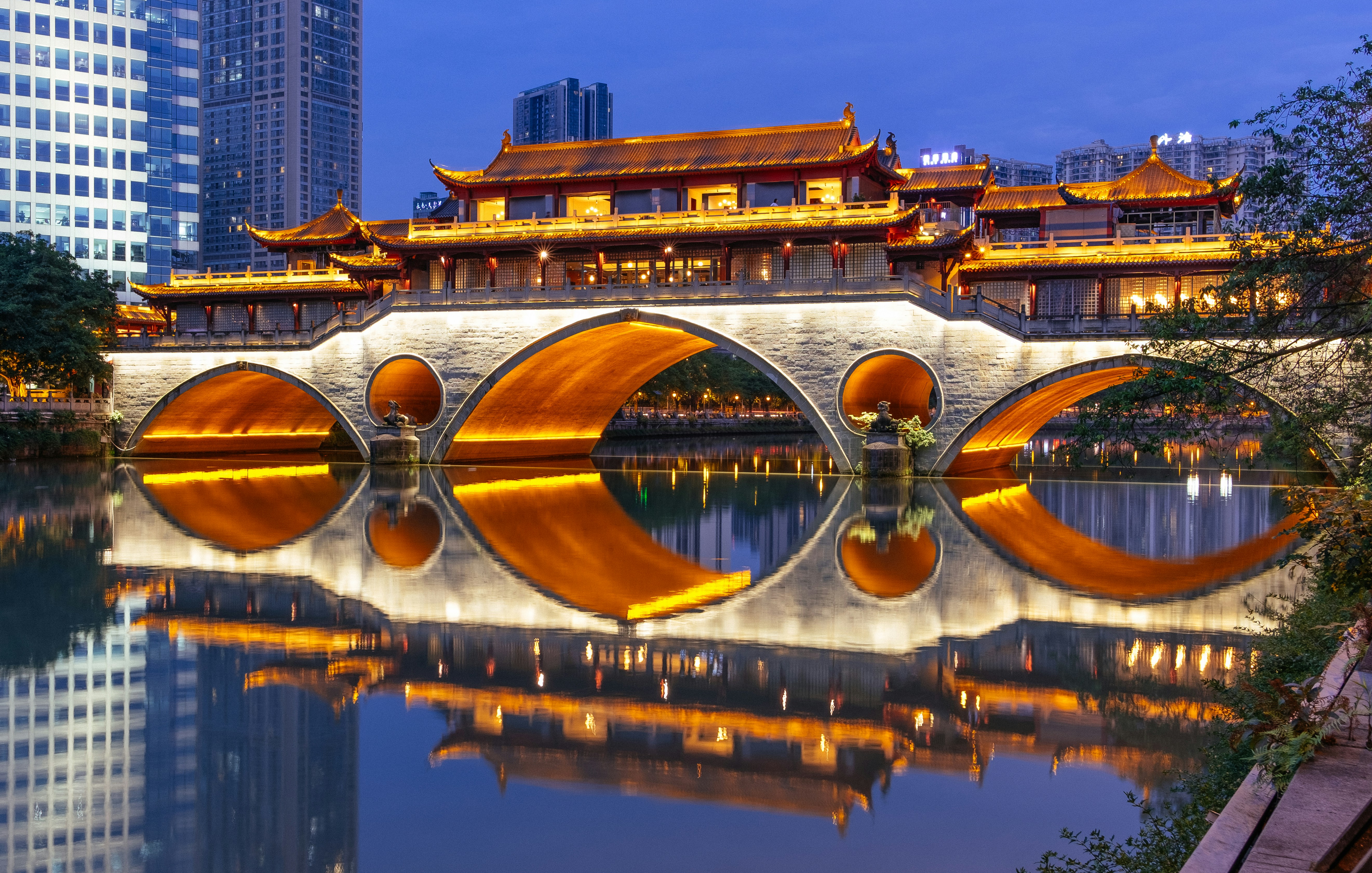 Brown building near bridge at night photo – Free Building Image on Unsplash