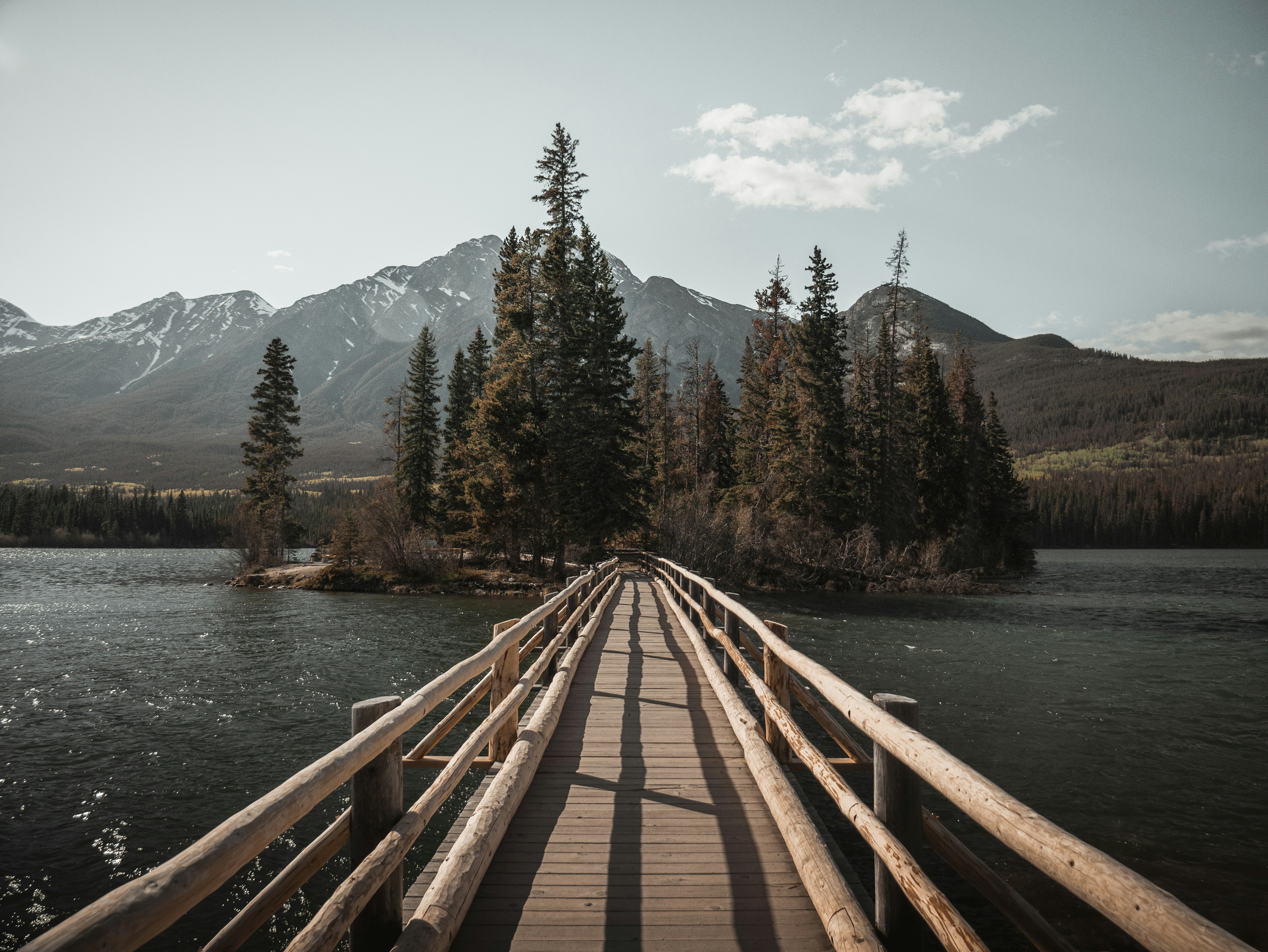 Island with beige wooden bridge above water photo – Free Water Image on ...