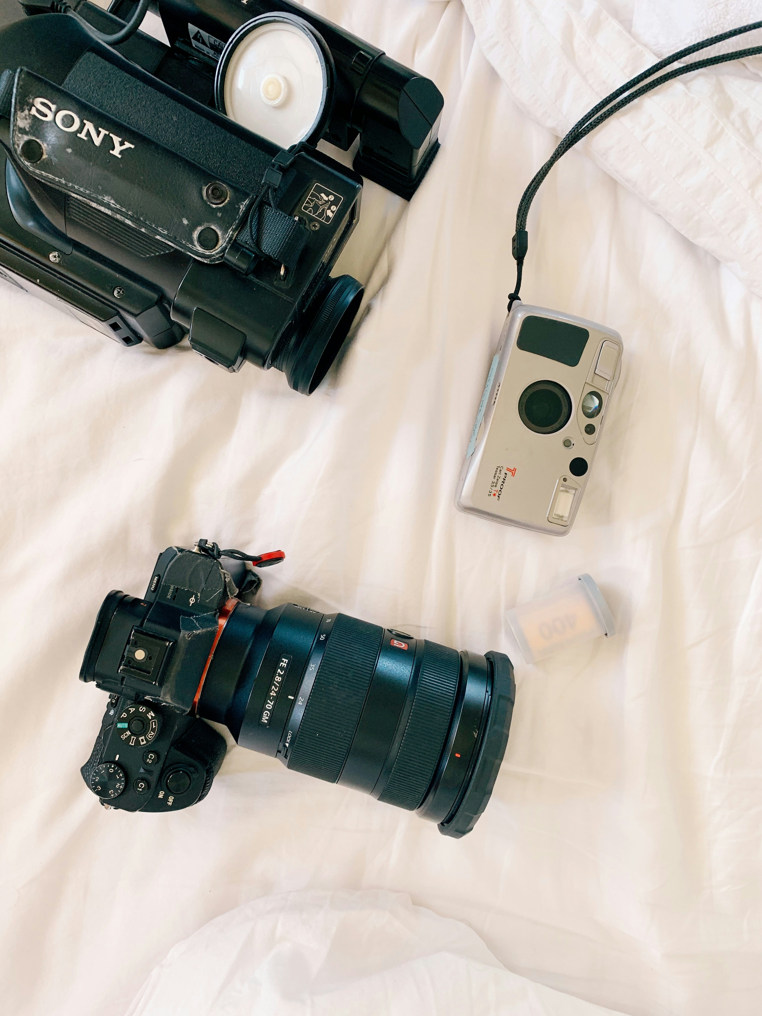 Silent Ensemble of Vintage Pro Cameras on a Soft Linen Stage