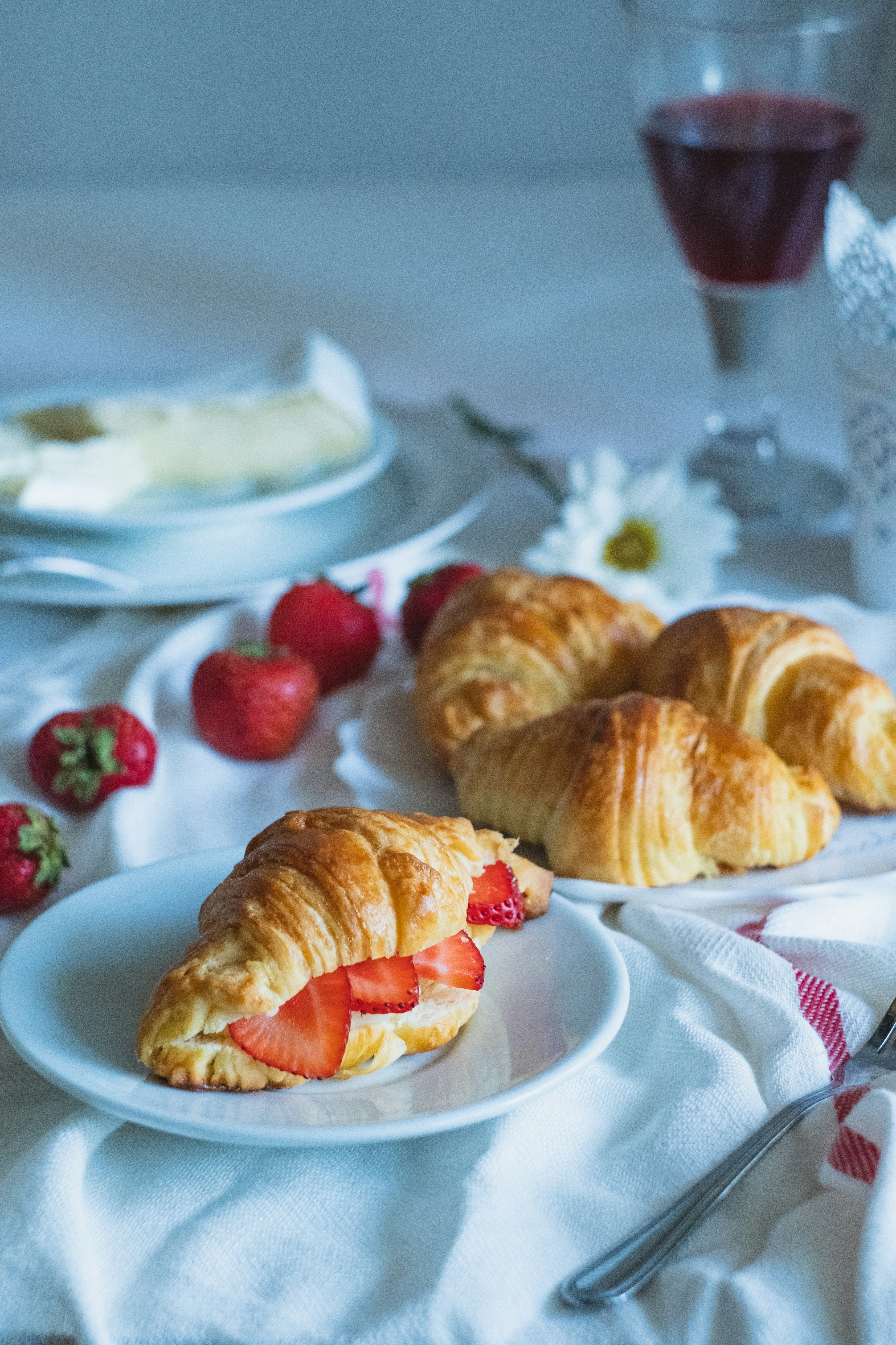 Sunlit Croissants and Strawberry Fillings on a Quiet Breakfast Table