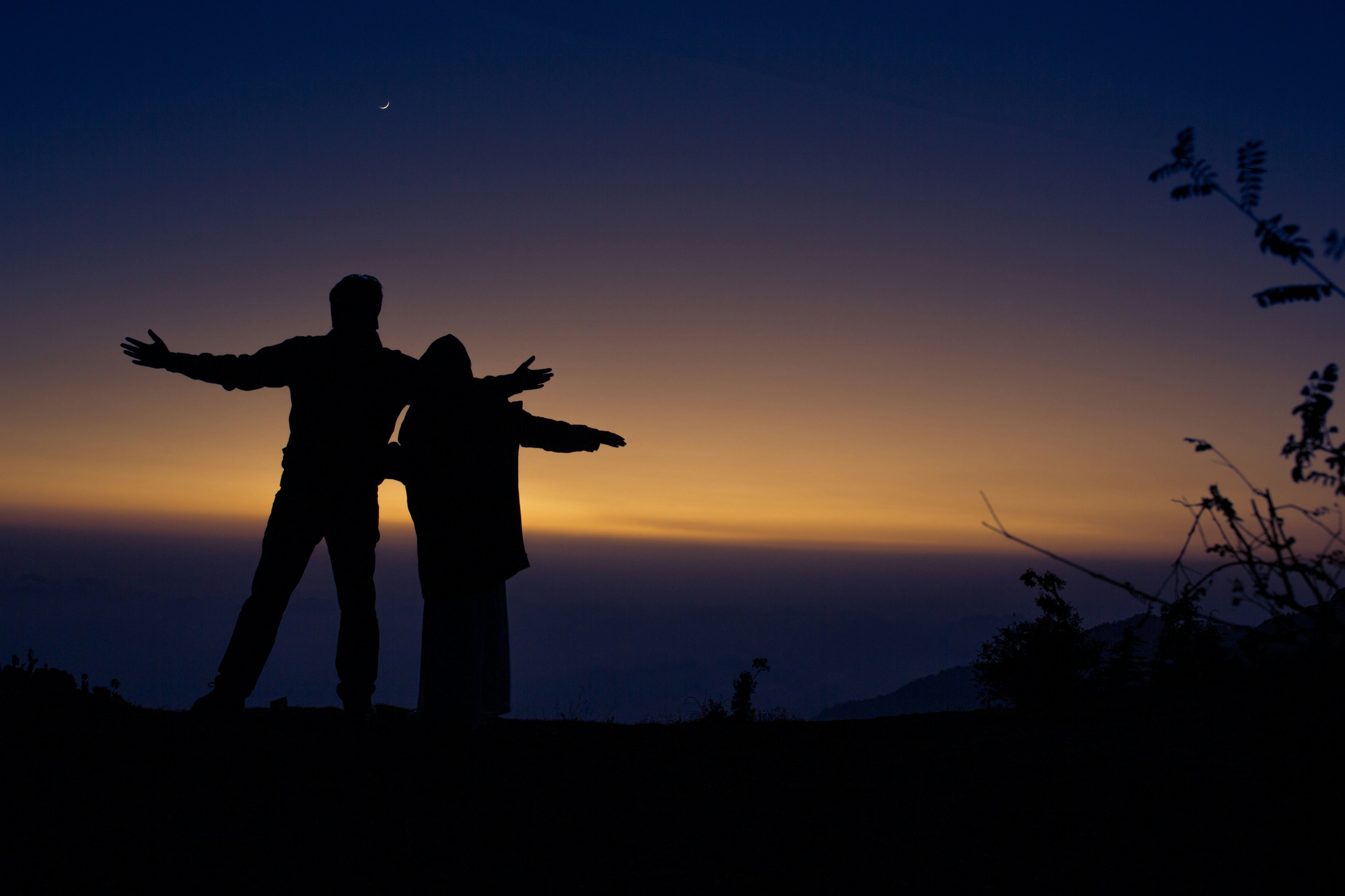 Two silhouette of person standing outdoor during nighttime photo – Free ...