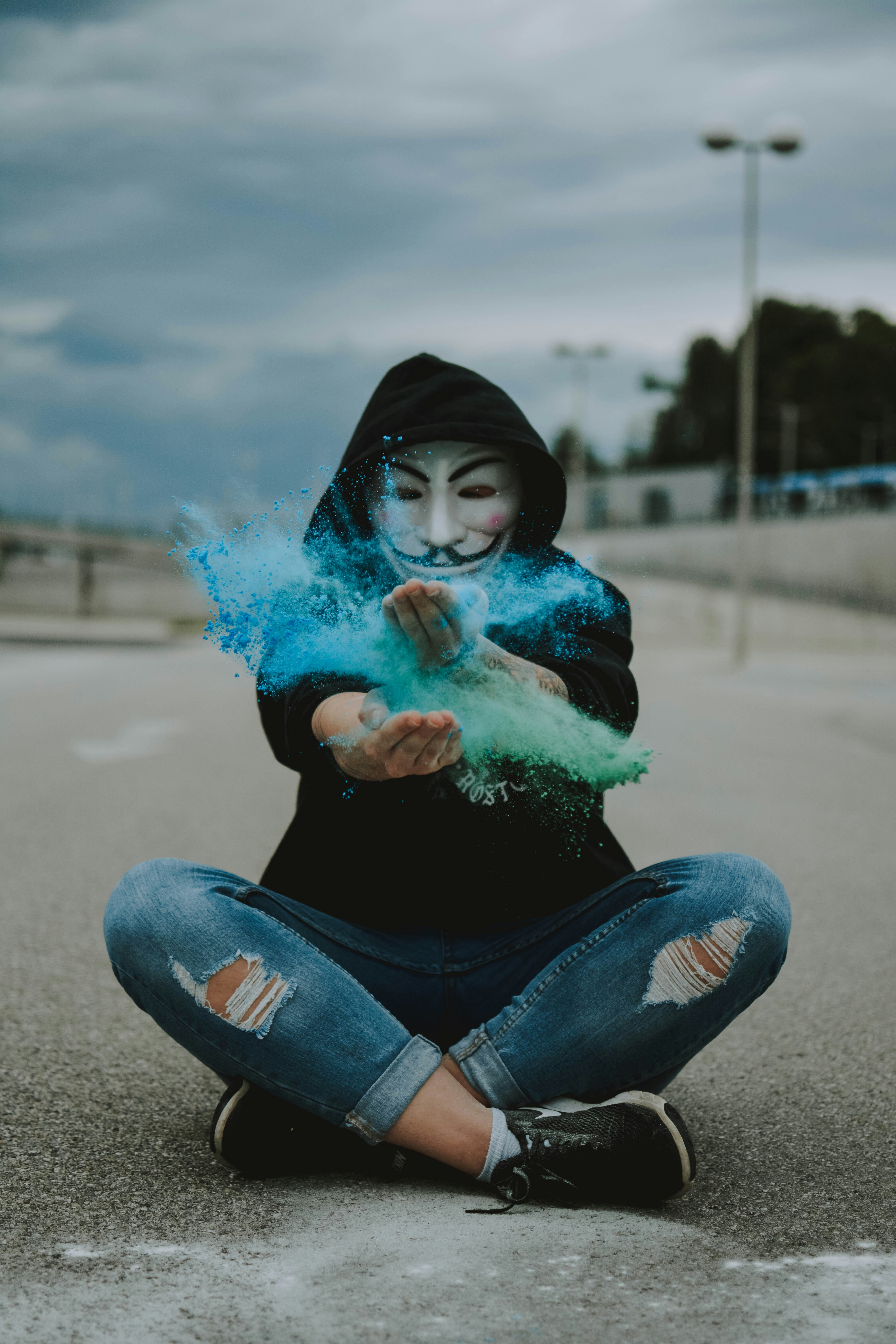Person sits on road photo – Free Human Image on Unsplash