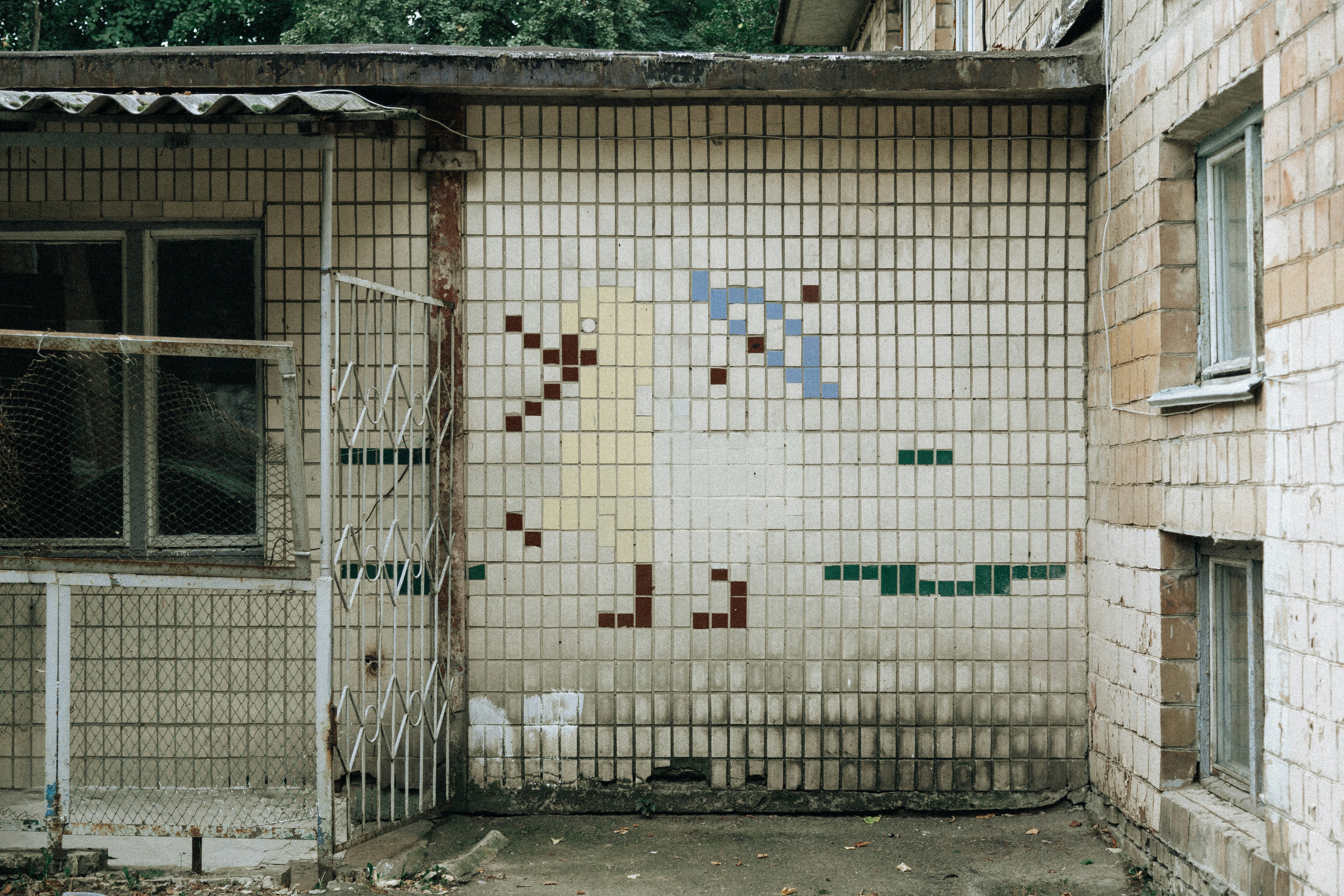 Weathered Play of Tiles: A Quiet Courtyard Wall