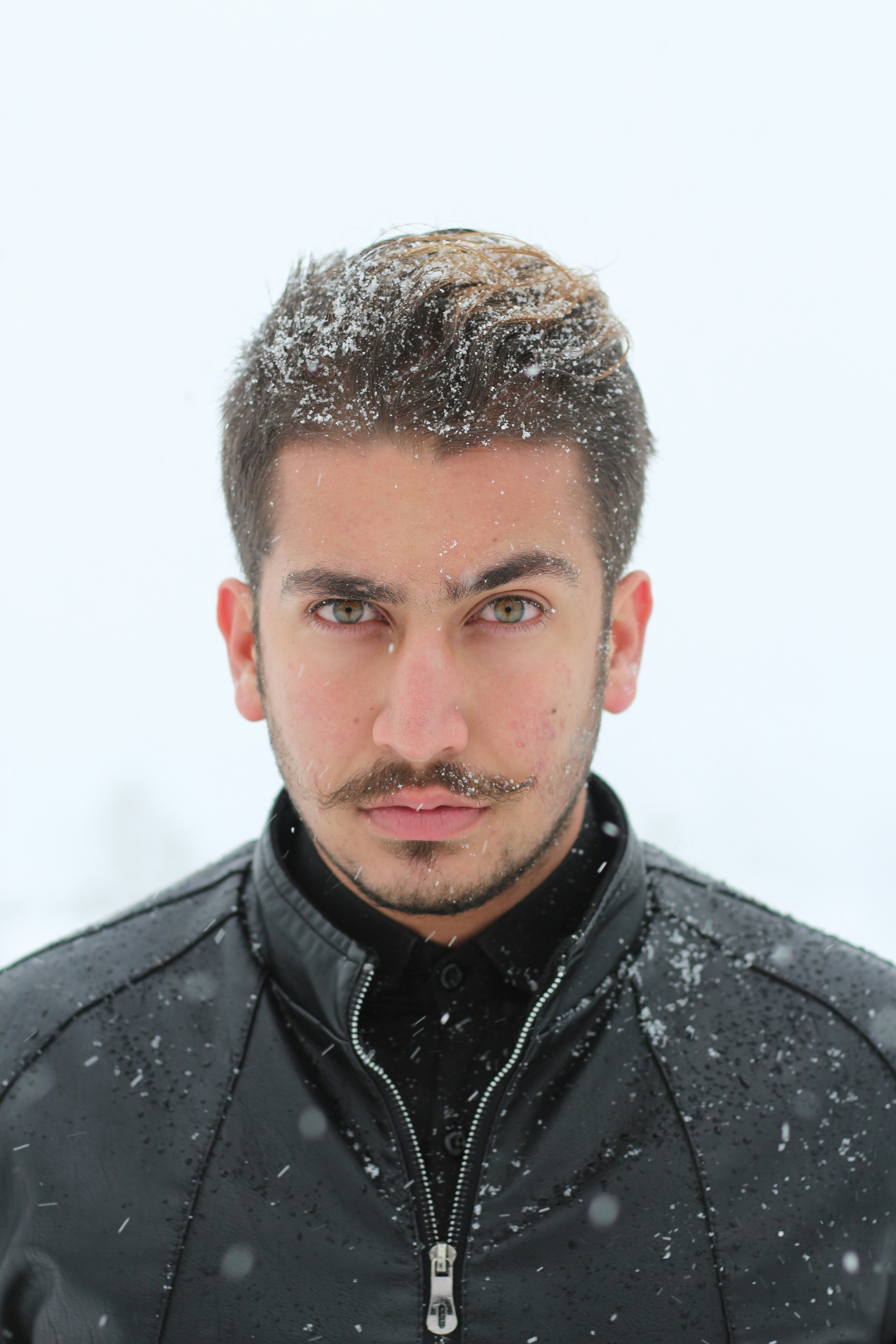 Snowbound Gaze: A Portrait with Winter Steel in Focus