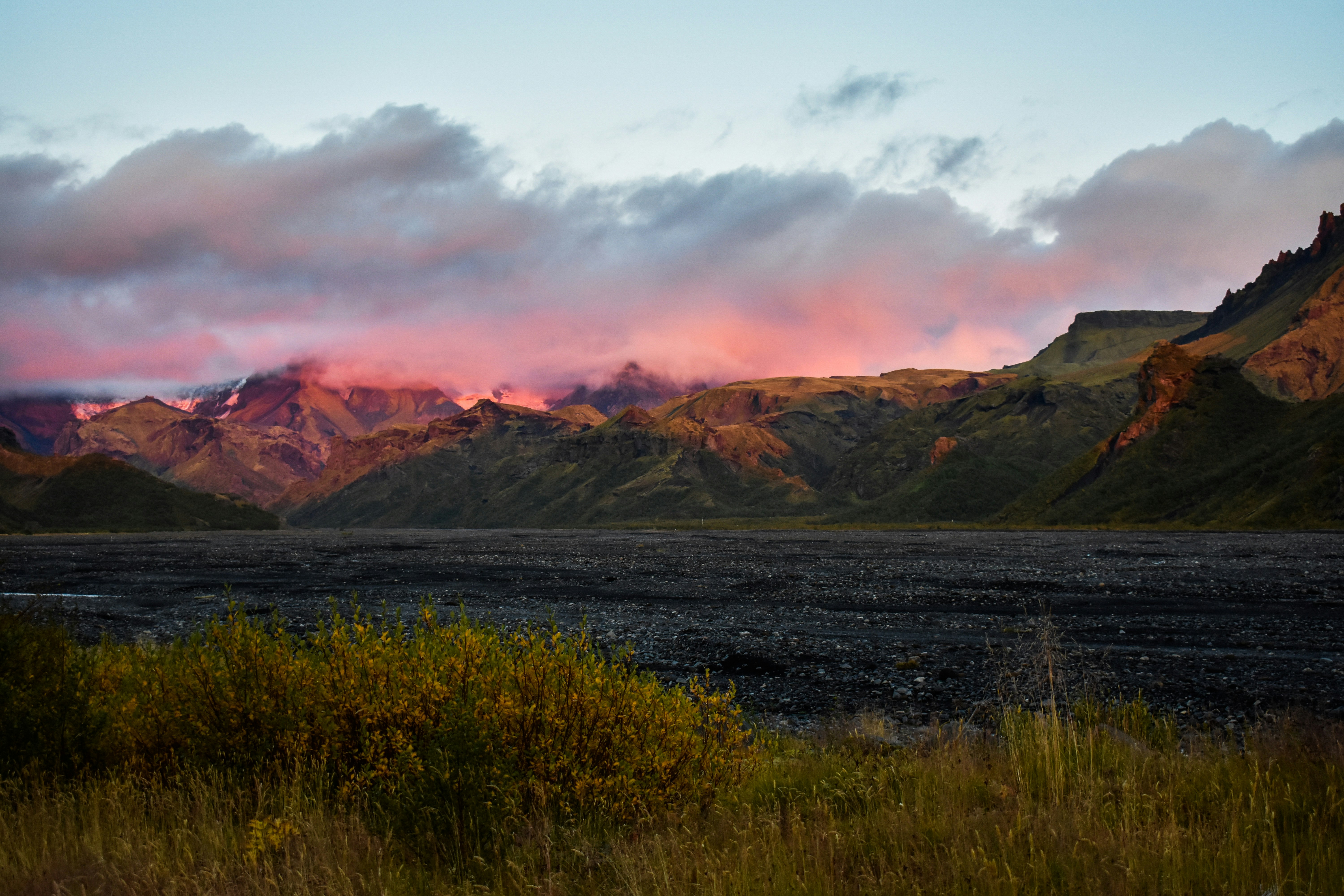 Dawn's Ember Ridge Over a Quiet Volcanic Plain