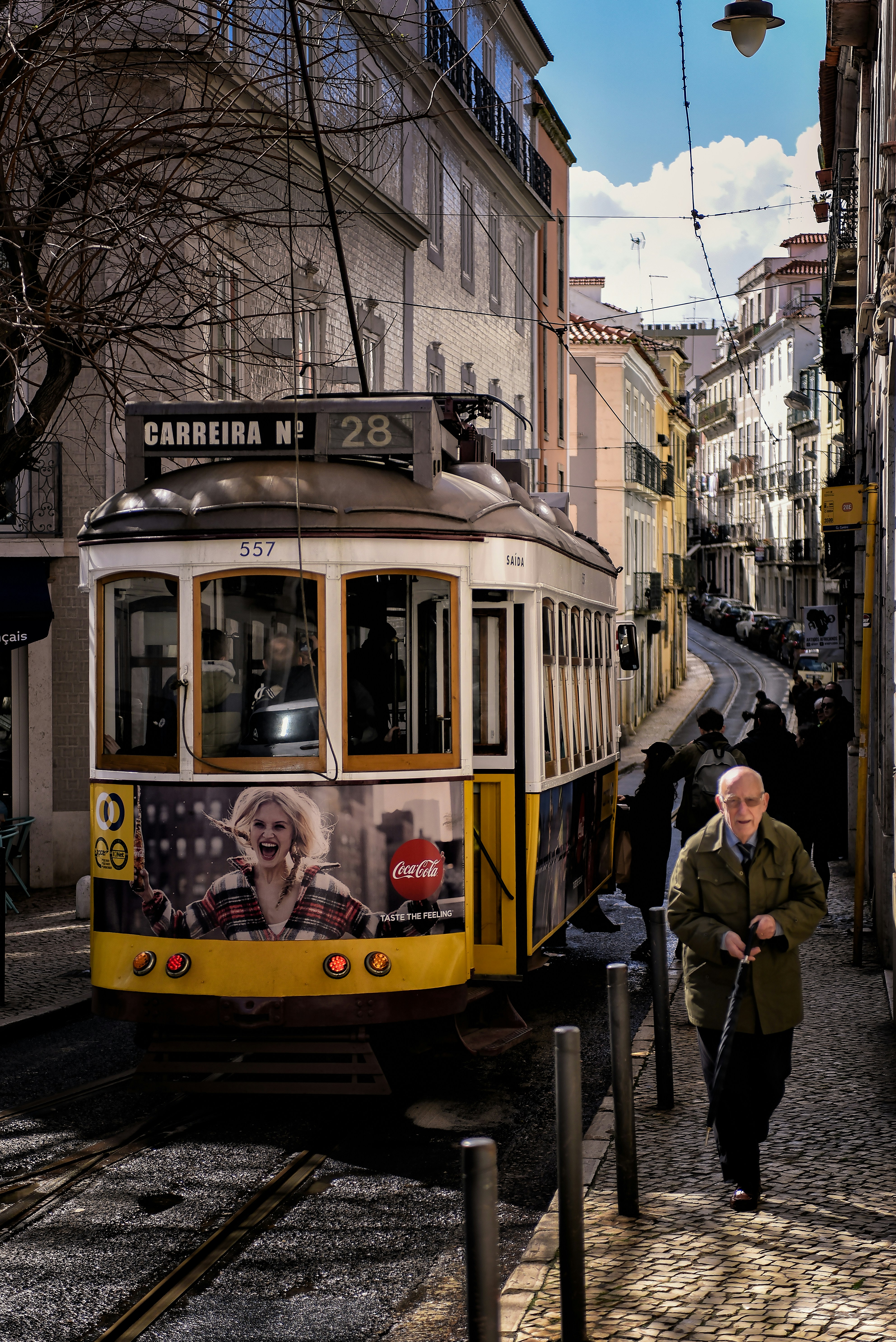 white and yellow tram during daytime