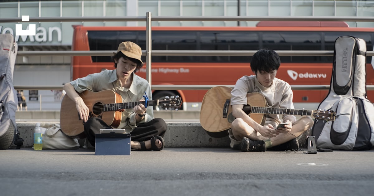 Man Wearing Gray Dress Shirt Playing Acoustic Guitar On Street Photo