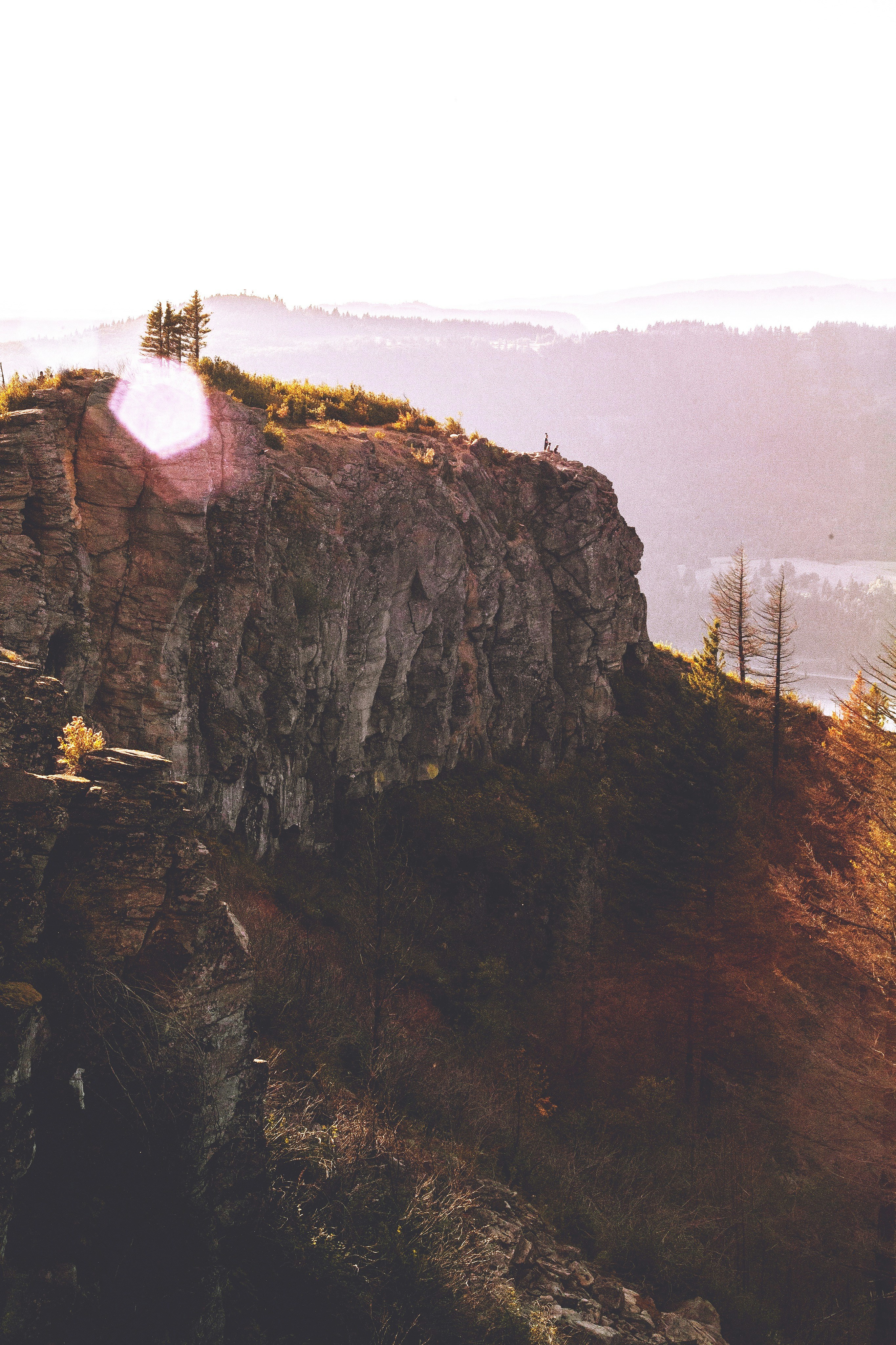 a person standing on top of a cliff