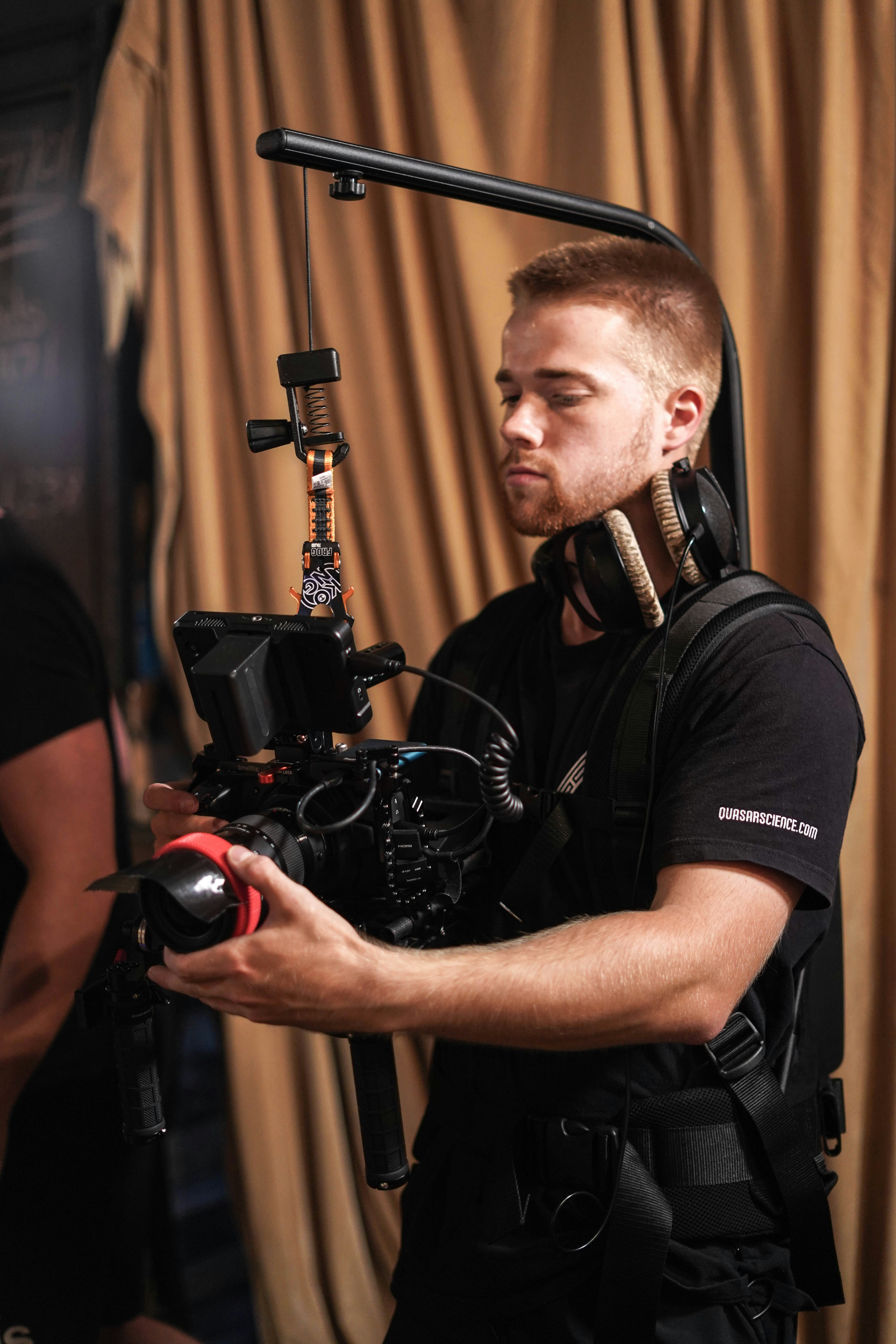 Man carrying camera photo – Free Human Image on Unsplash