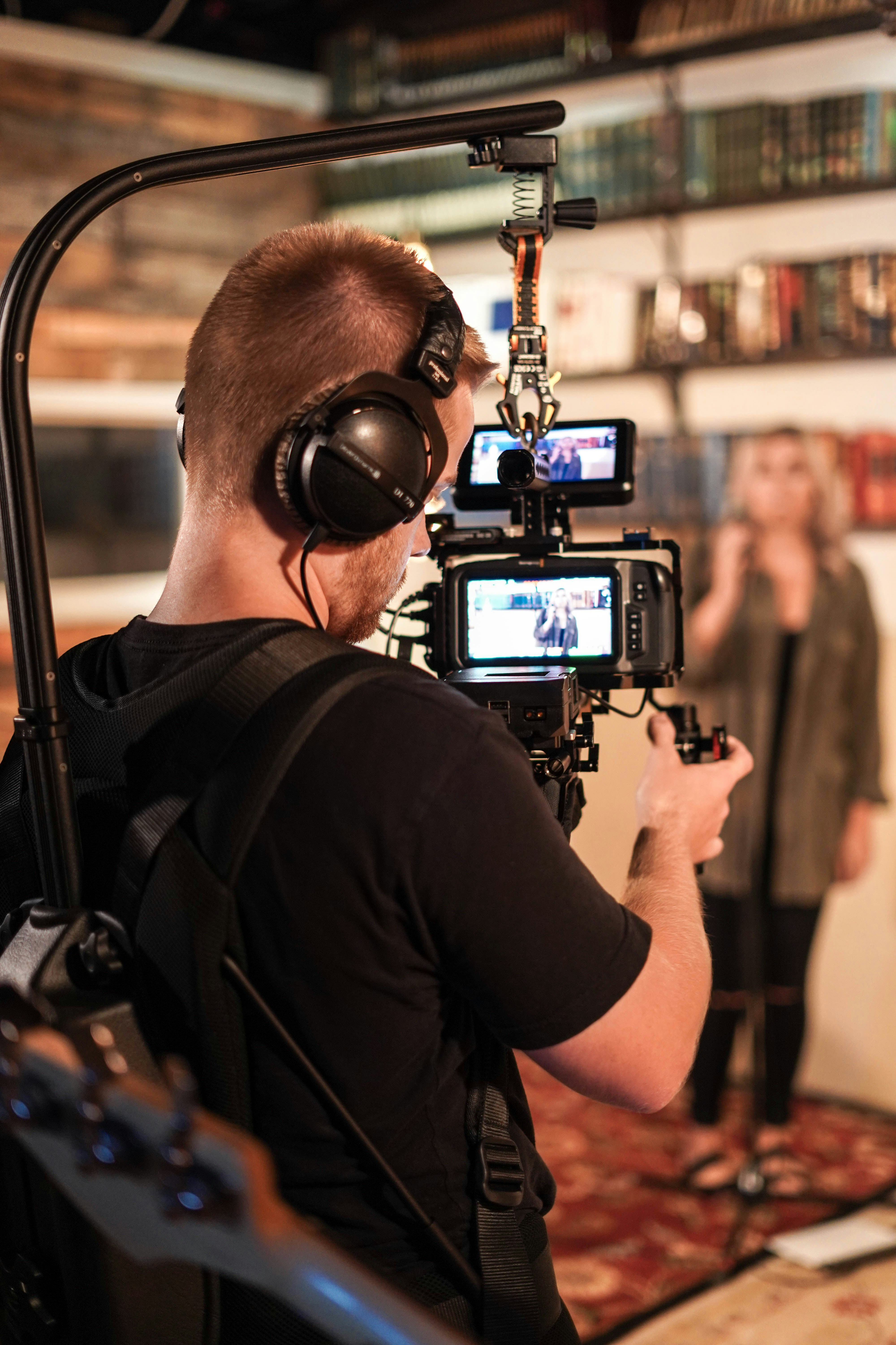 Man using video camera photo – Free Person Image on Unsplash