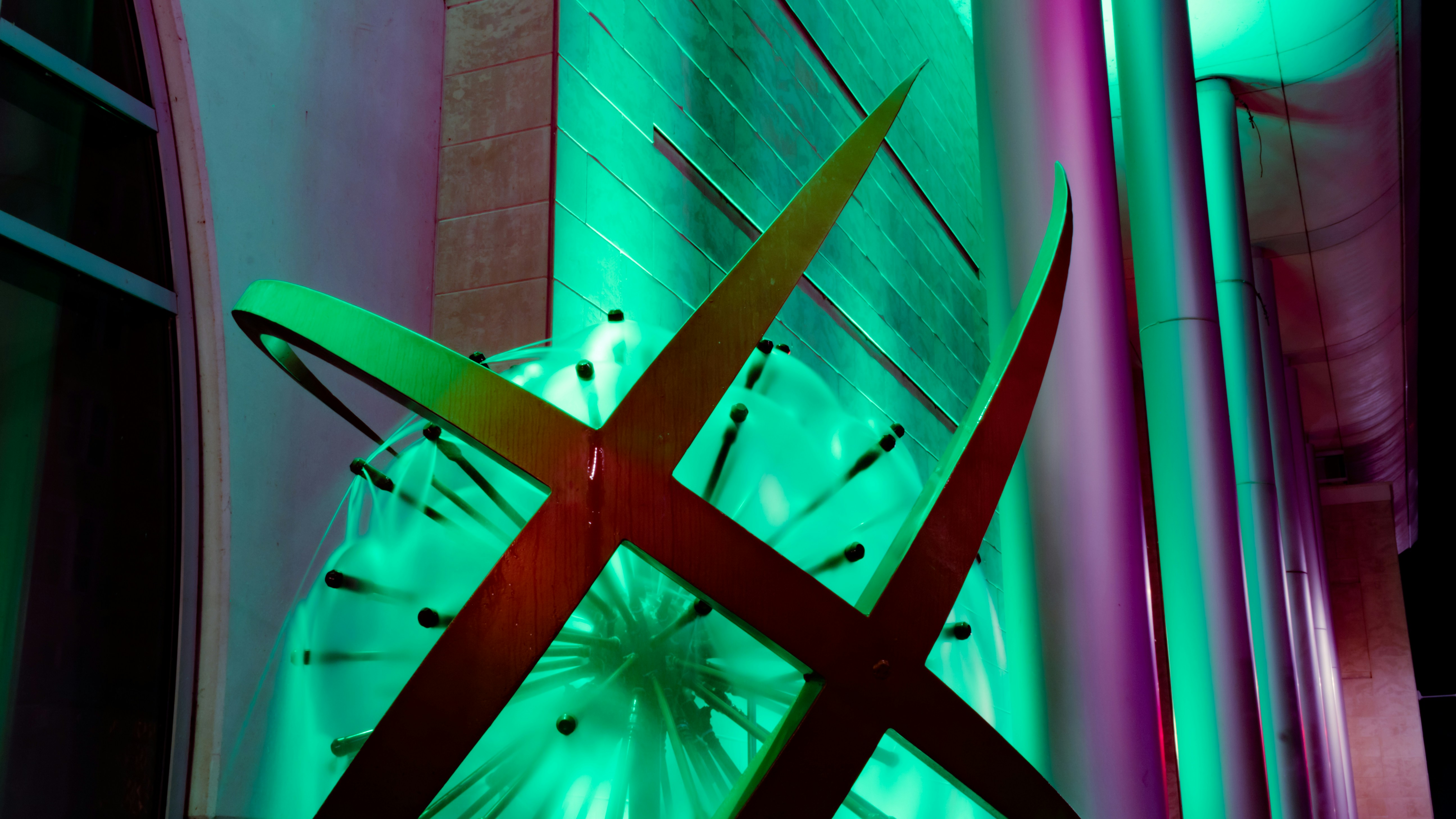 Emerald X in Neon Atrium: A Study in Light and Geometry