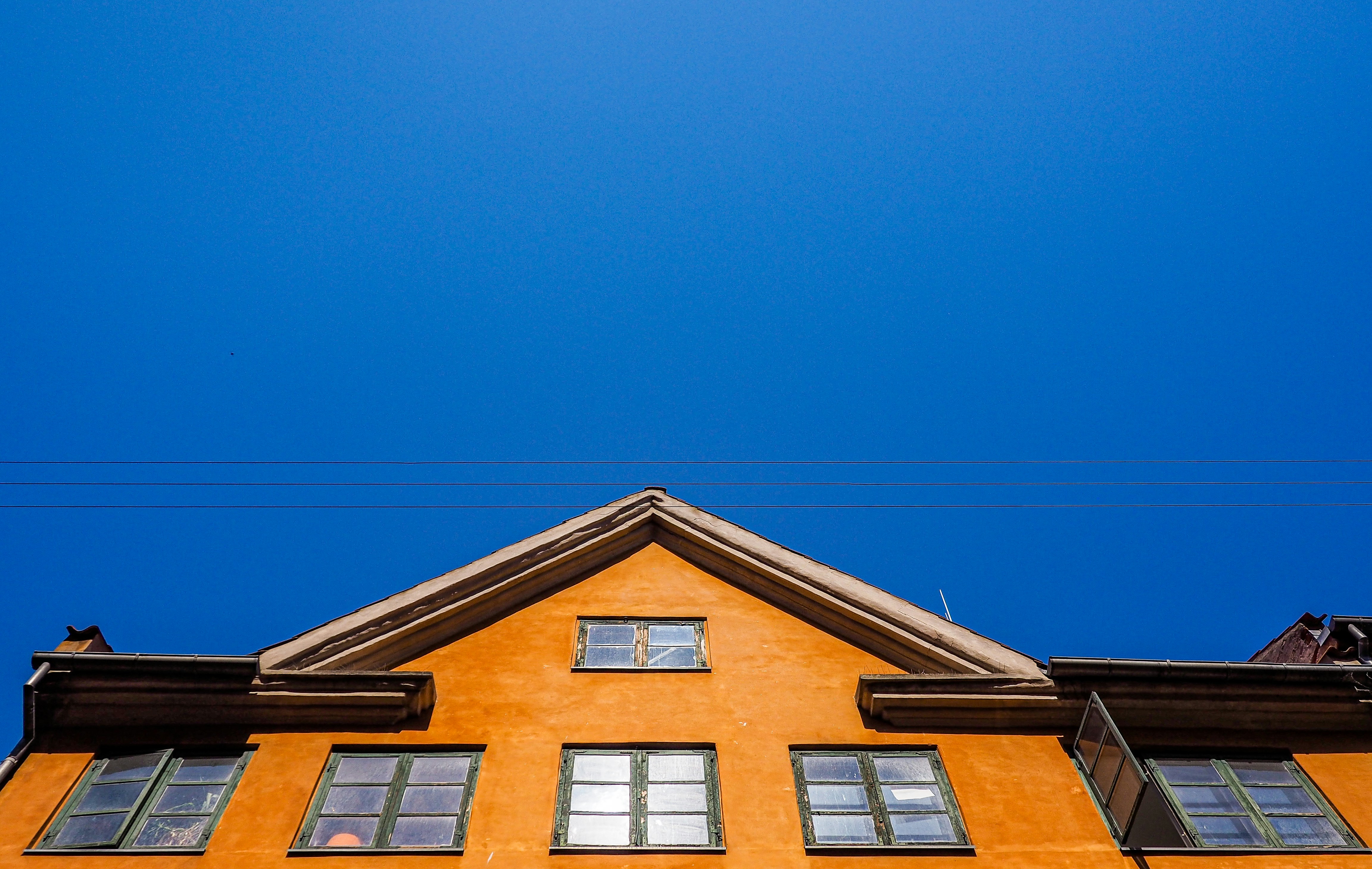 Orange concrete building photo – Free Blue Image on Unsplash