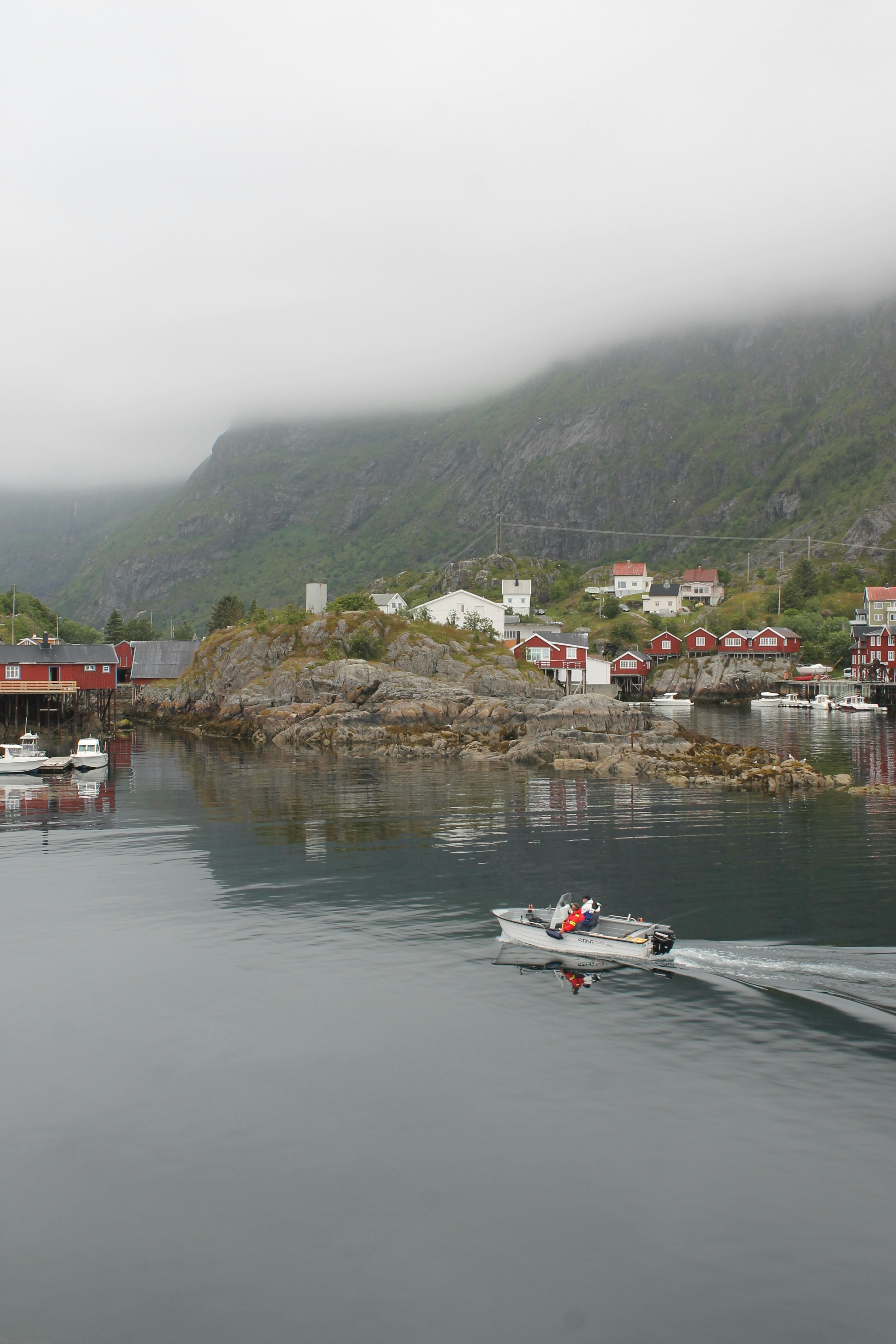 white boat on calm water during \daytime