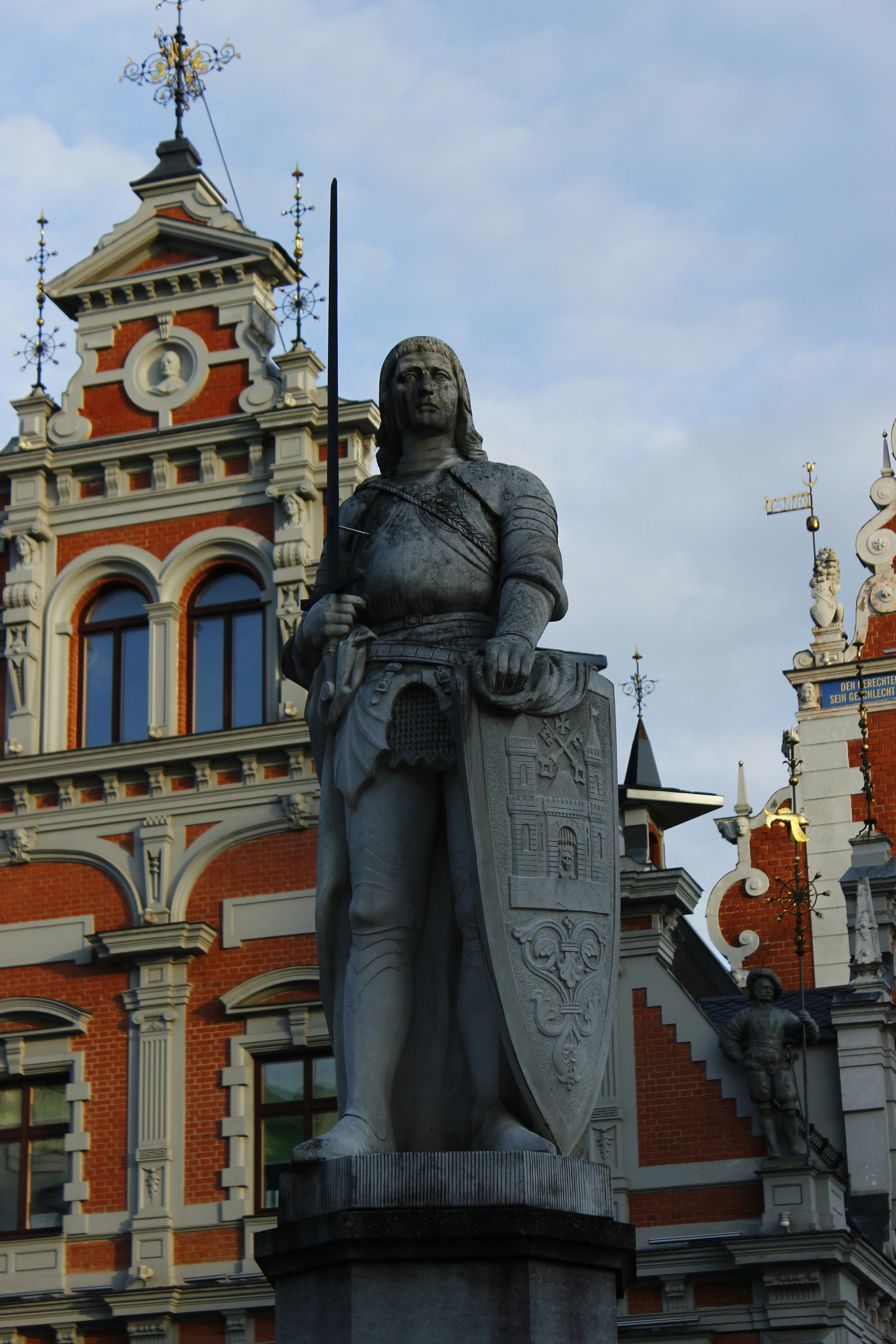 Knight in Stone: A Regal Sentinel Over a Ornate City Facade