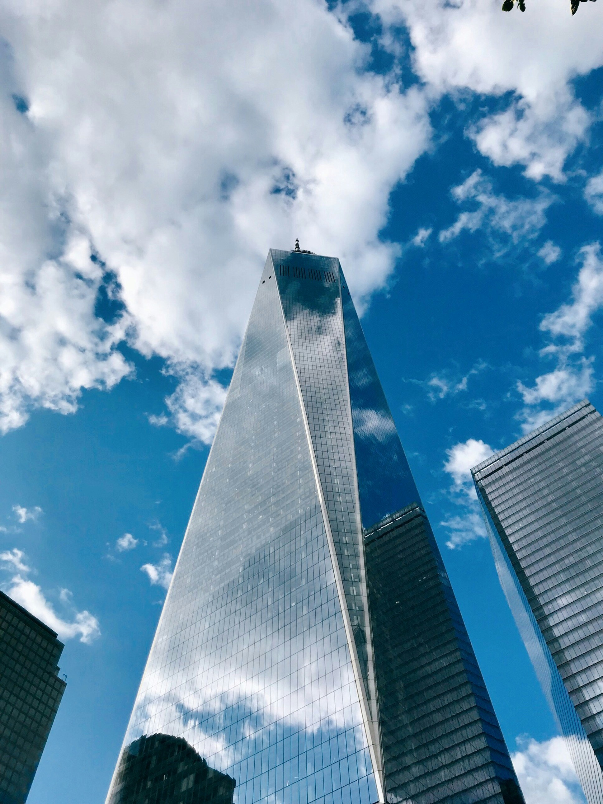 Worm view photo of building under cloudy sky during daytime photo ...