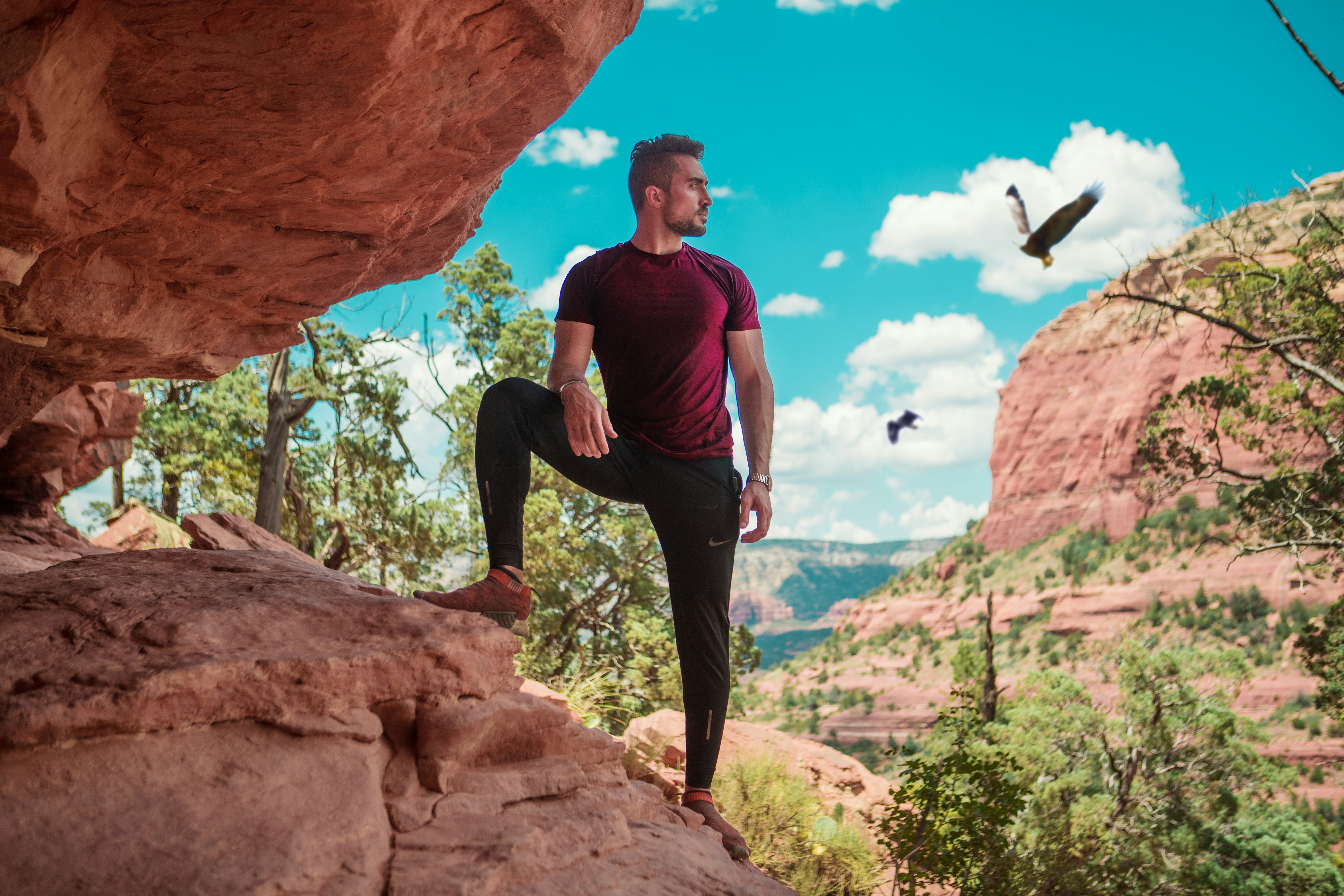 Cliffside Gaze: A Quiet Stance Amid Red Rock Canyon