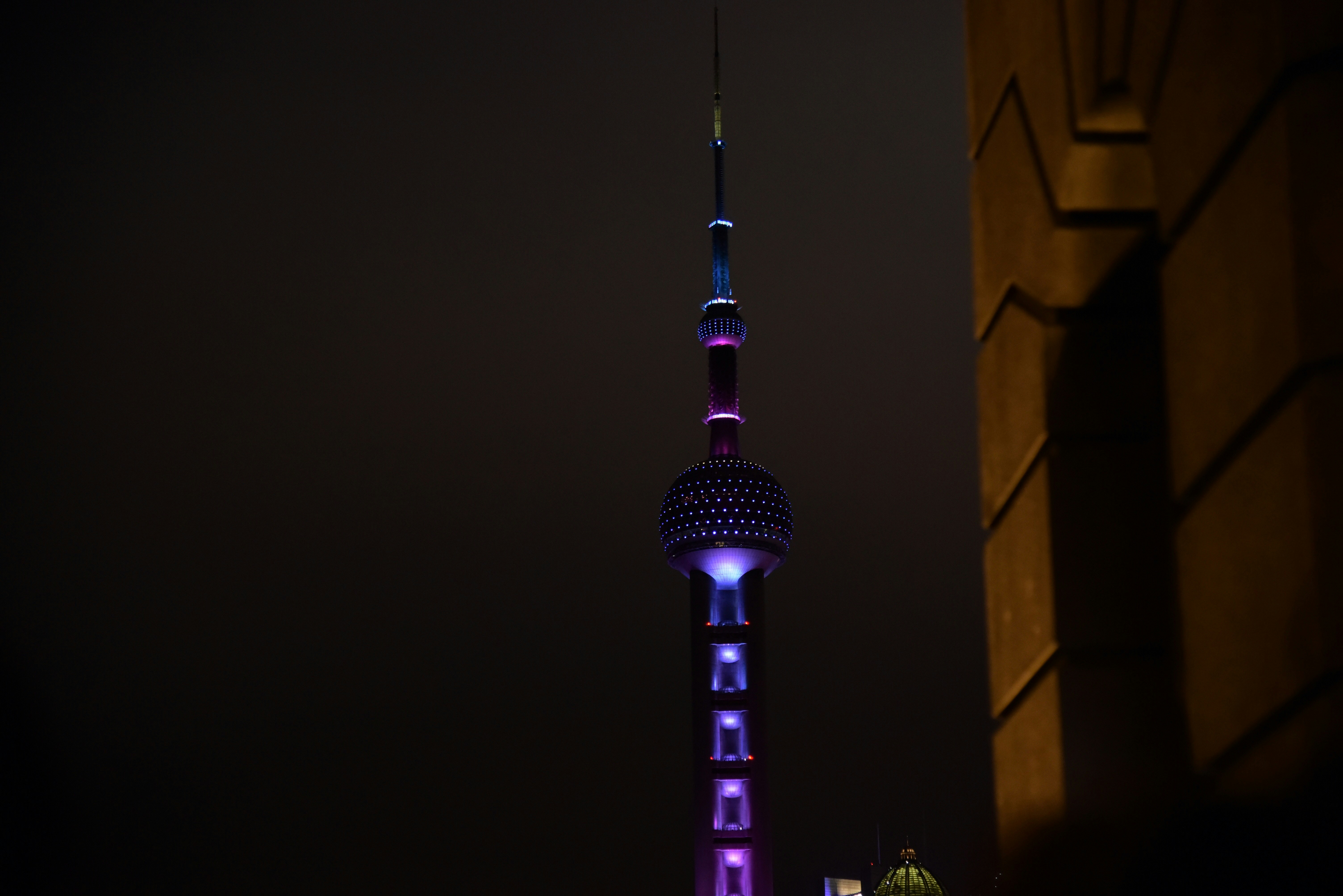 low-angle photo of tower during night time