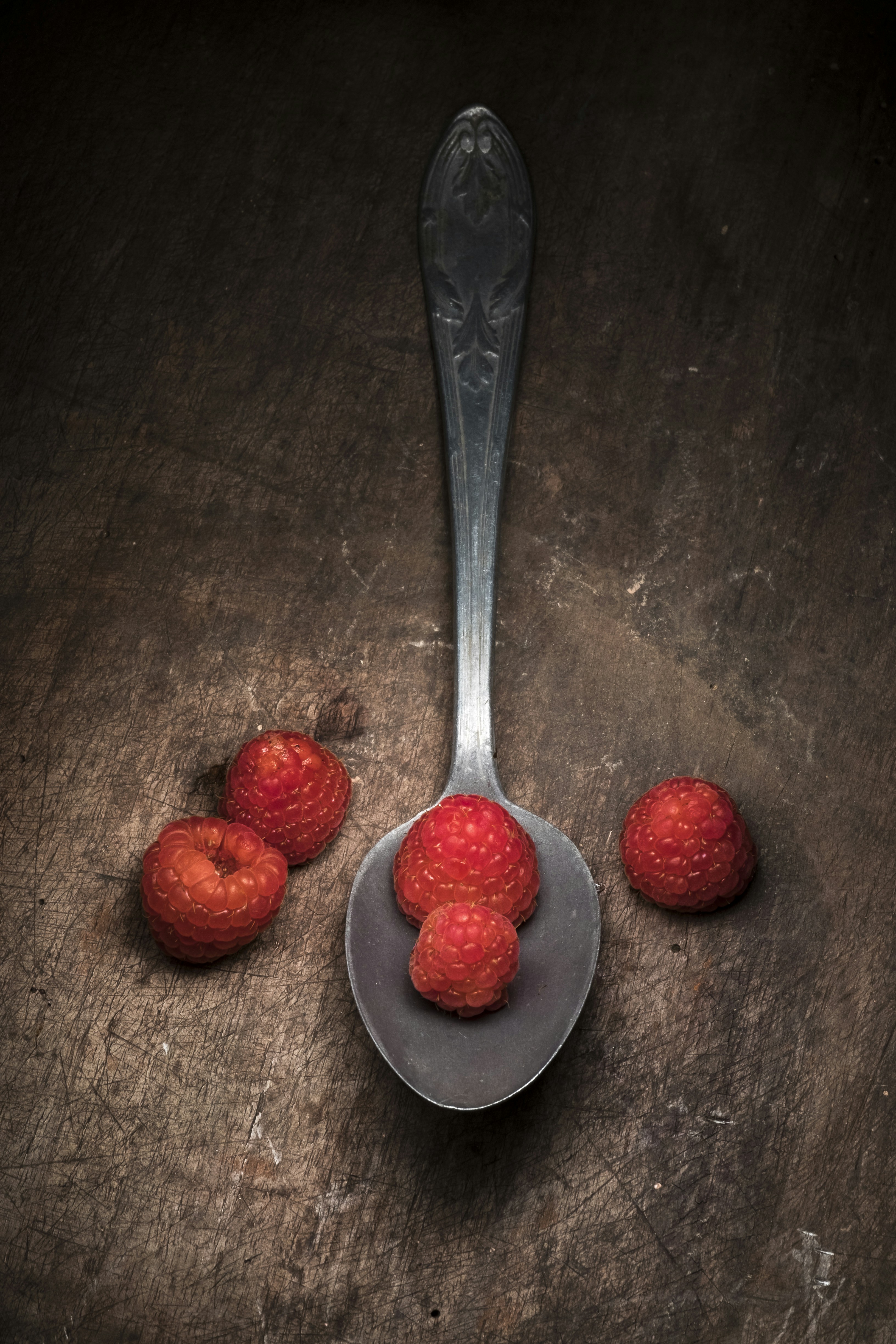  Raspberry Spotlight: A Spoonful of Red on A Dark Table
