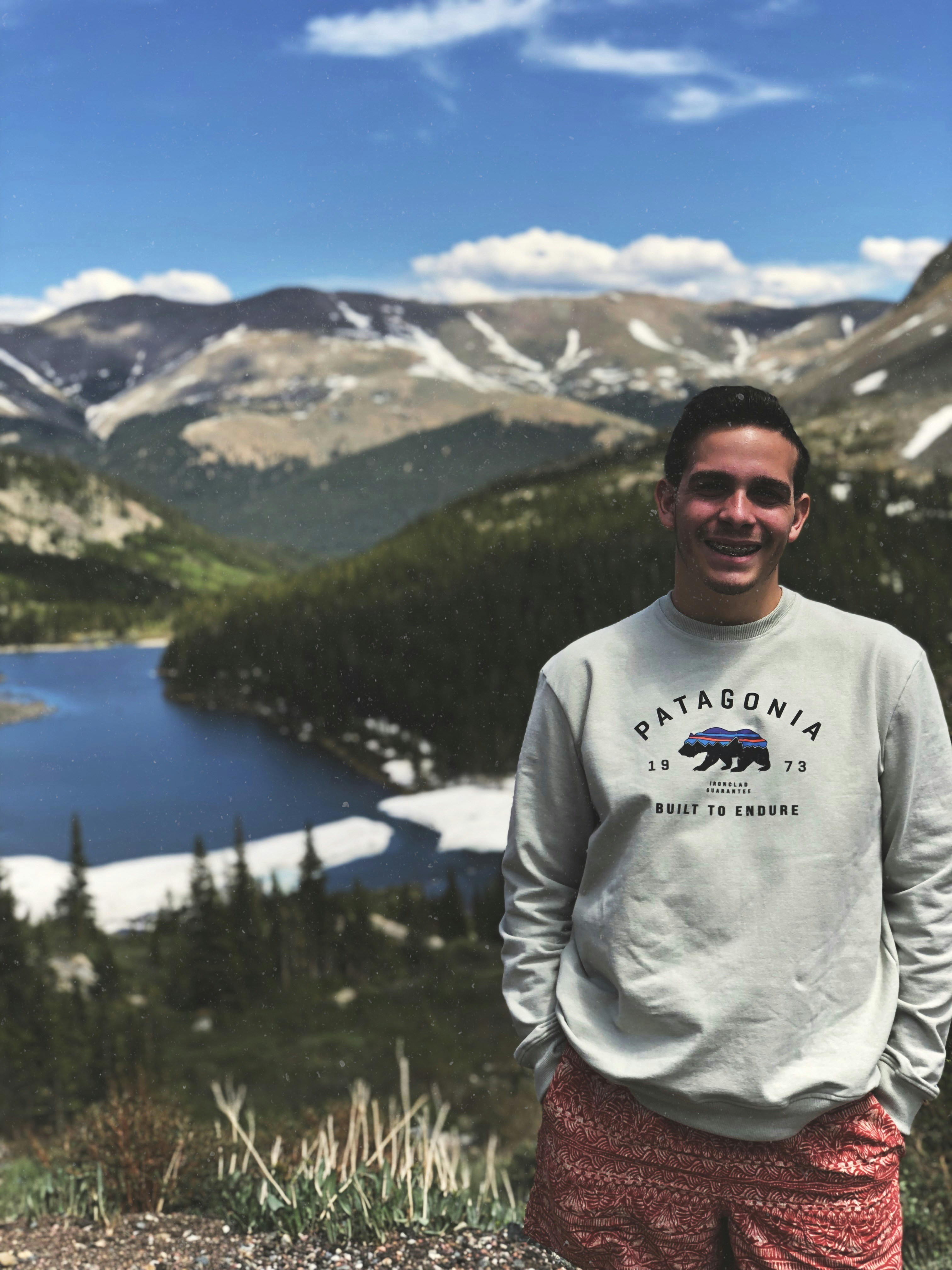 Hiker in a Glacier Basin: Calm, Confident Portrait Amid Mountain Lakes