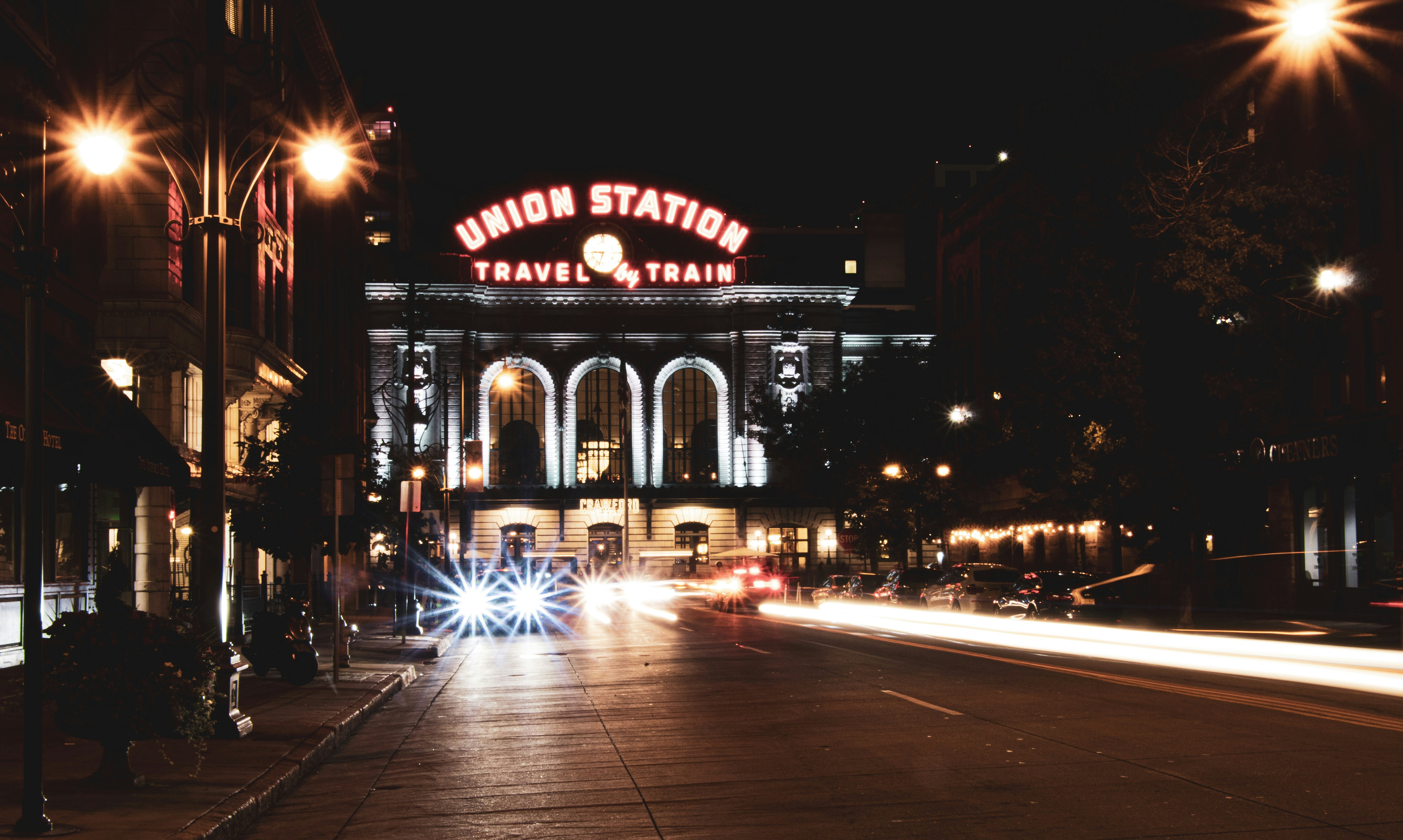 Night at Union Station: Illuminated Archways and Trains in Motion