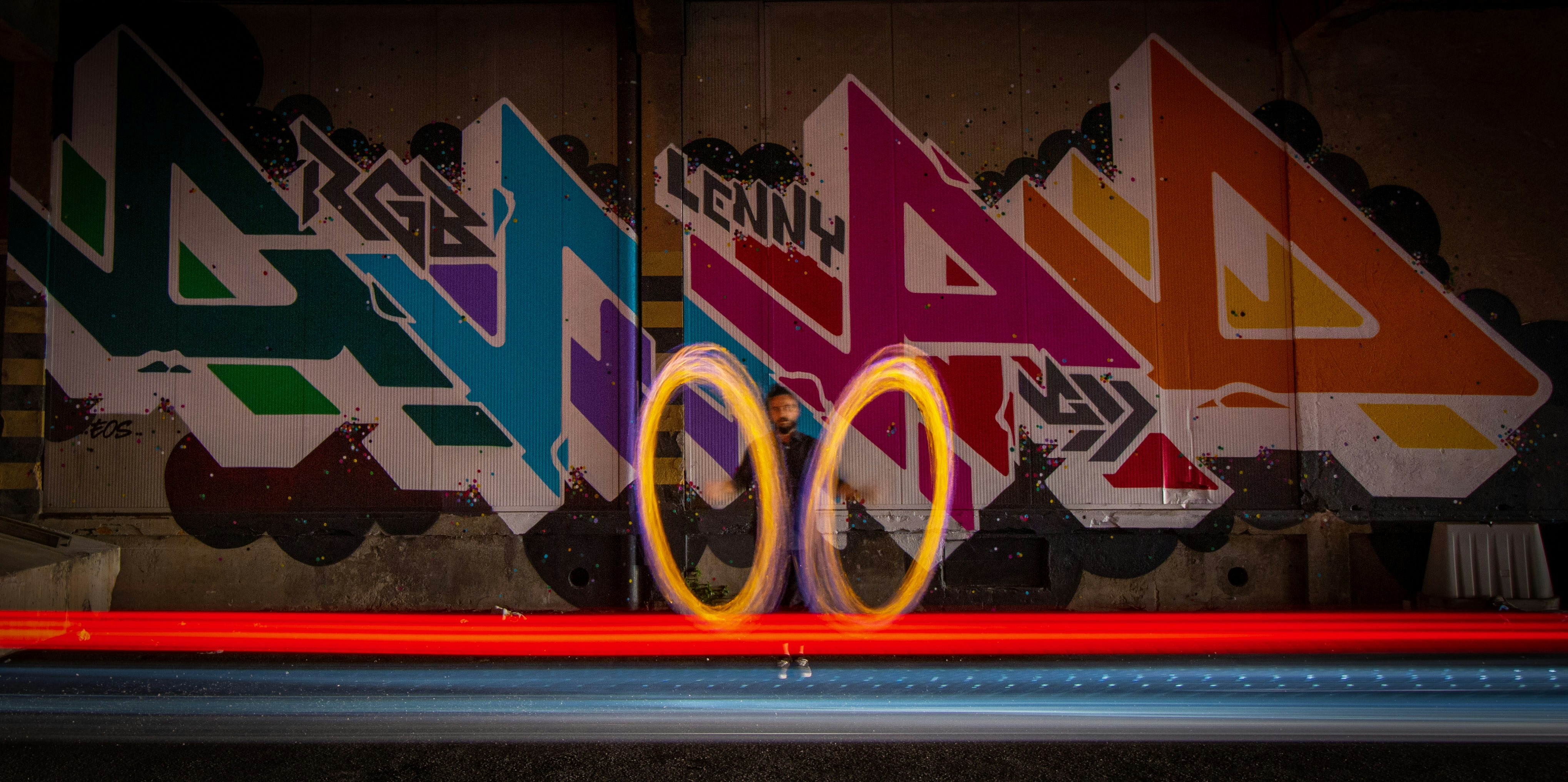 Neon Rings Before a Graffiti Backdrop