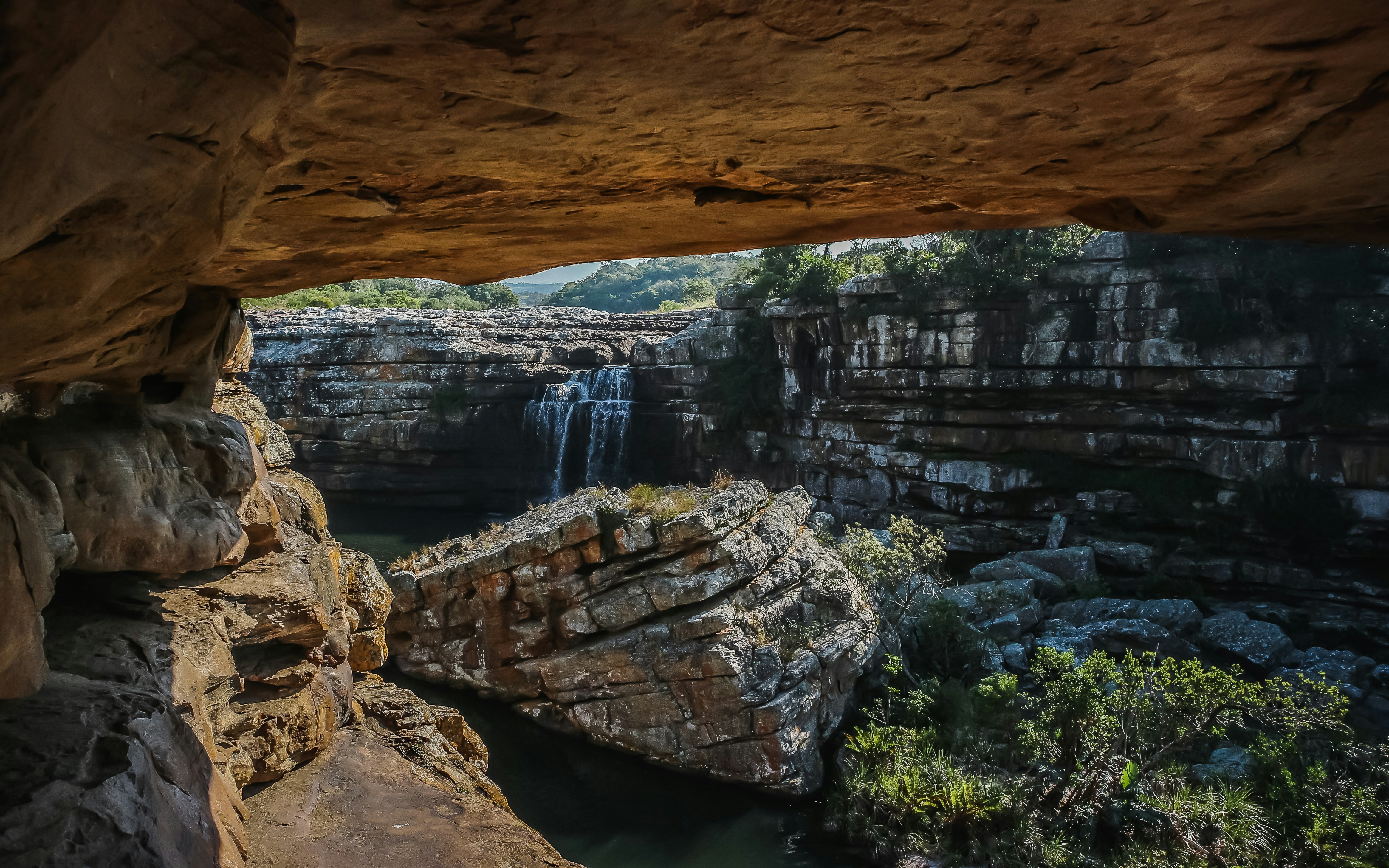 Green stones and waterfall photo – Free Baboon rock Image on Unsplash