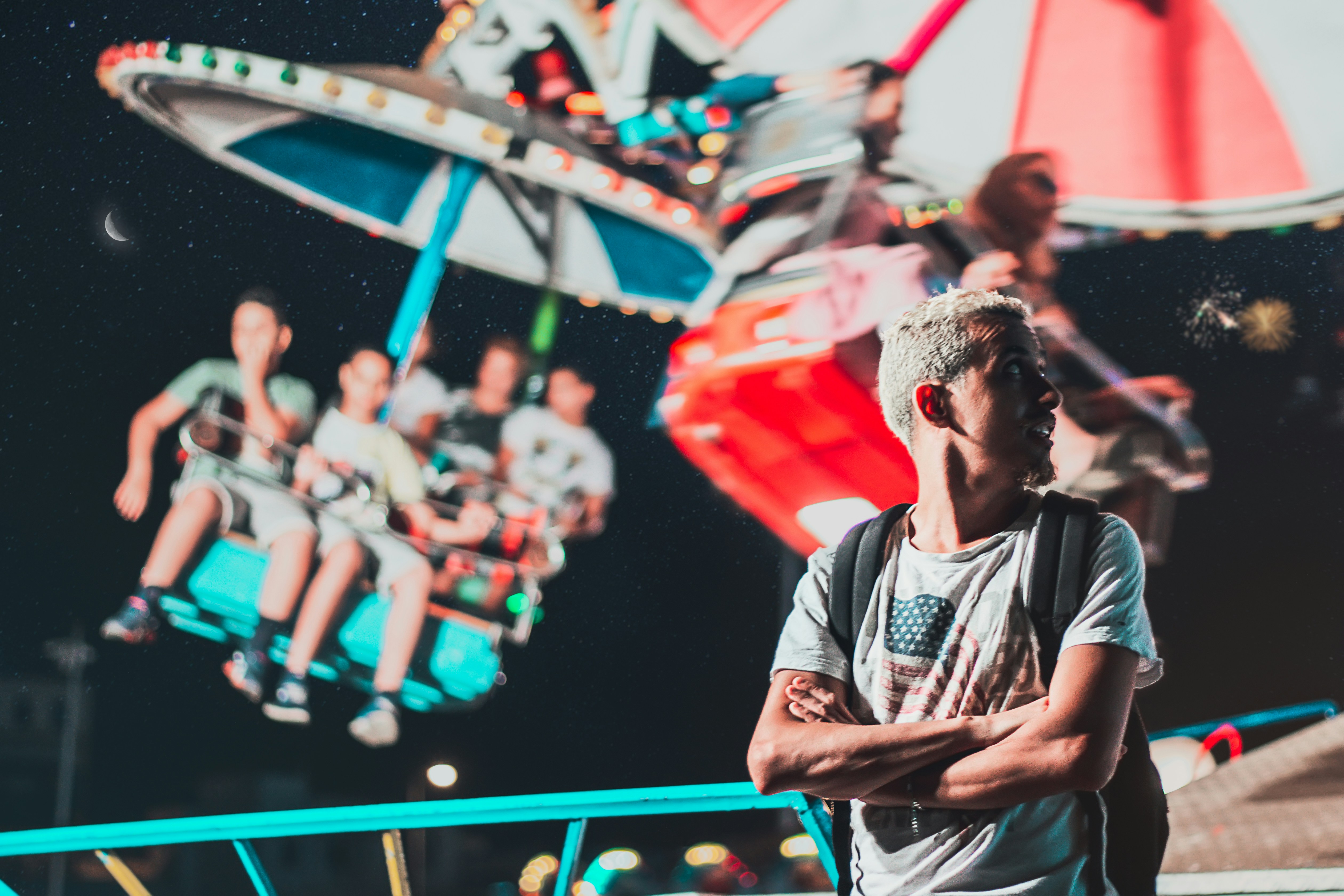 Crowded Night Ride: A Curious Piercing Gaze at the Fair
