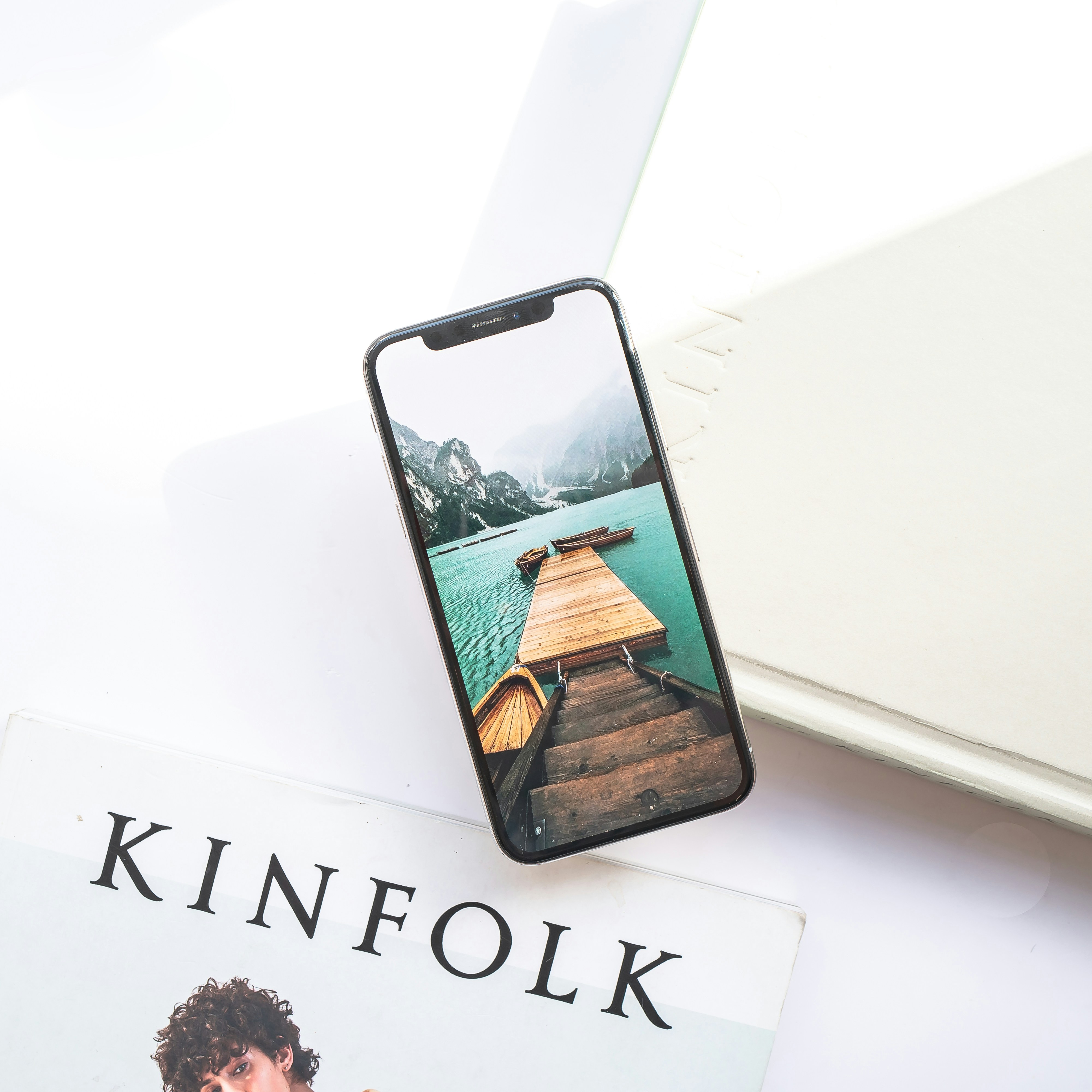 Dockside Display: A Smartphone Framing Turquoise Lake on Kinfolk