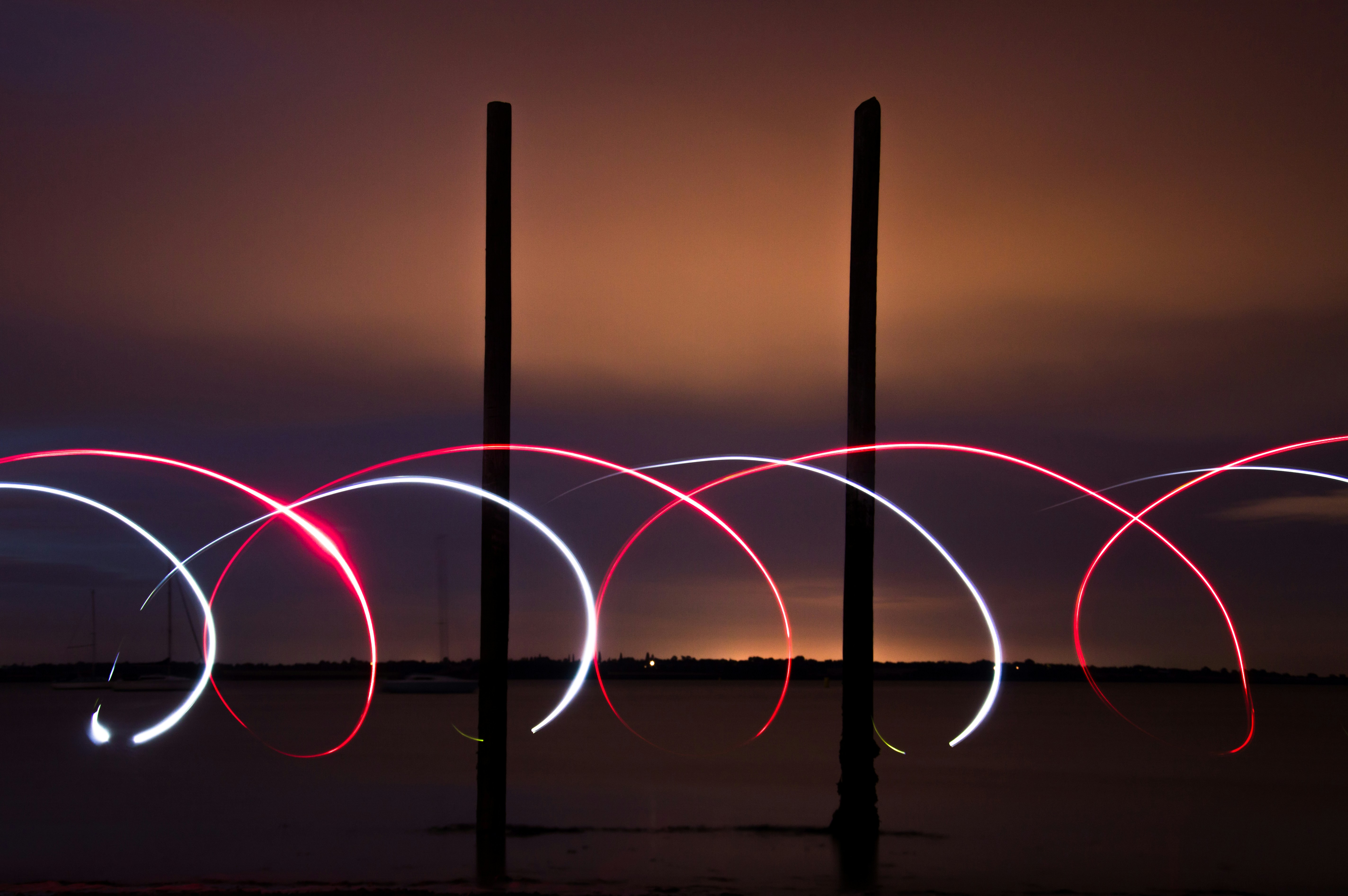 a group of poles with lights in the middle of them