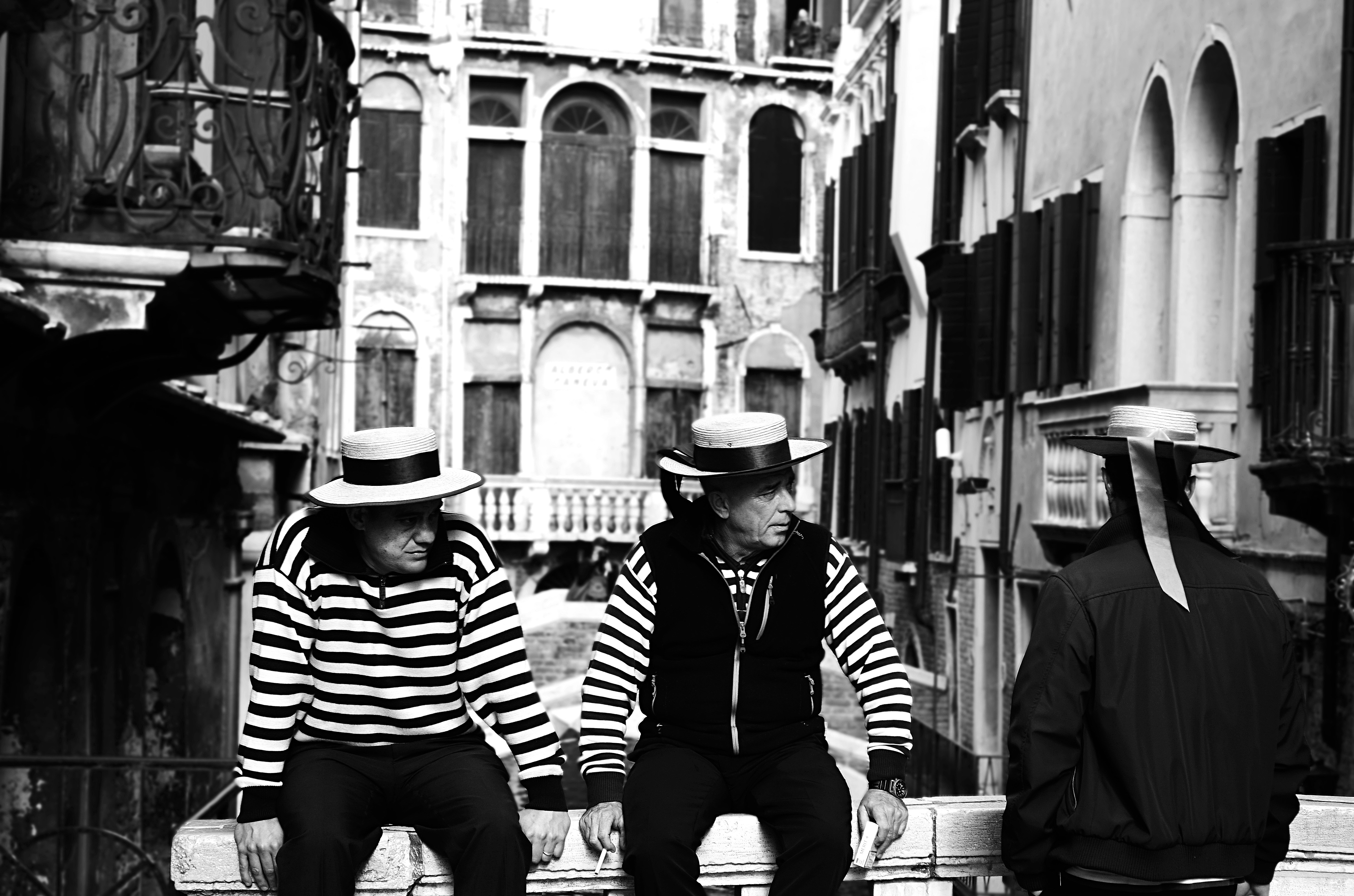 Grayscale photography unknown persons sitting outdoors photo – Free ...