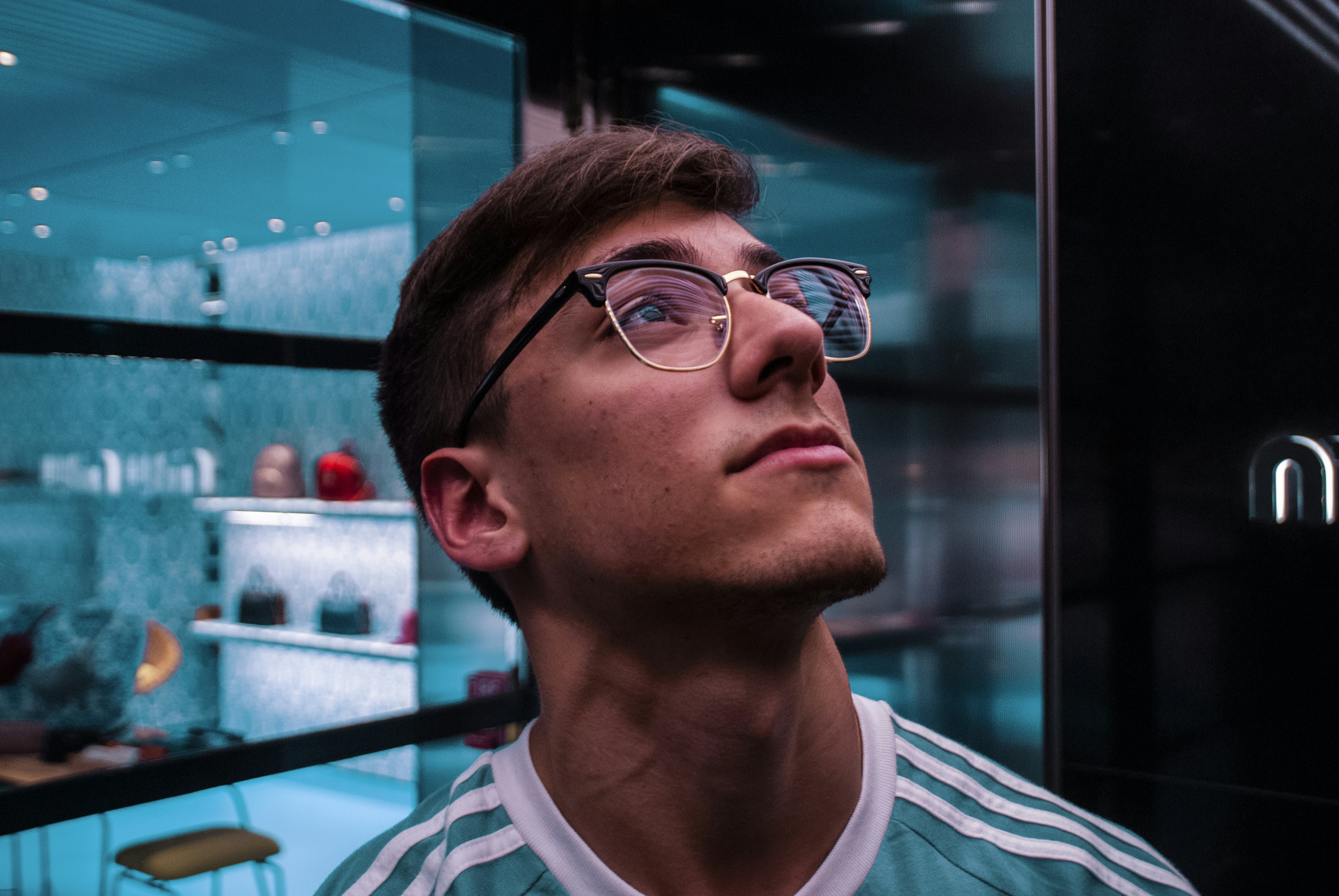 Glancing Up: A Portrait in Neon Reflections