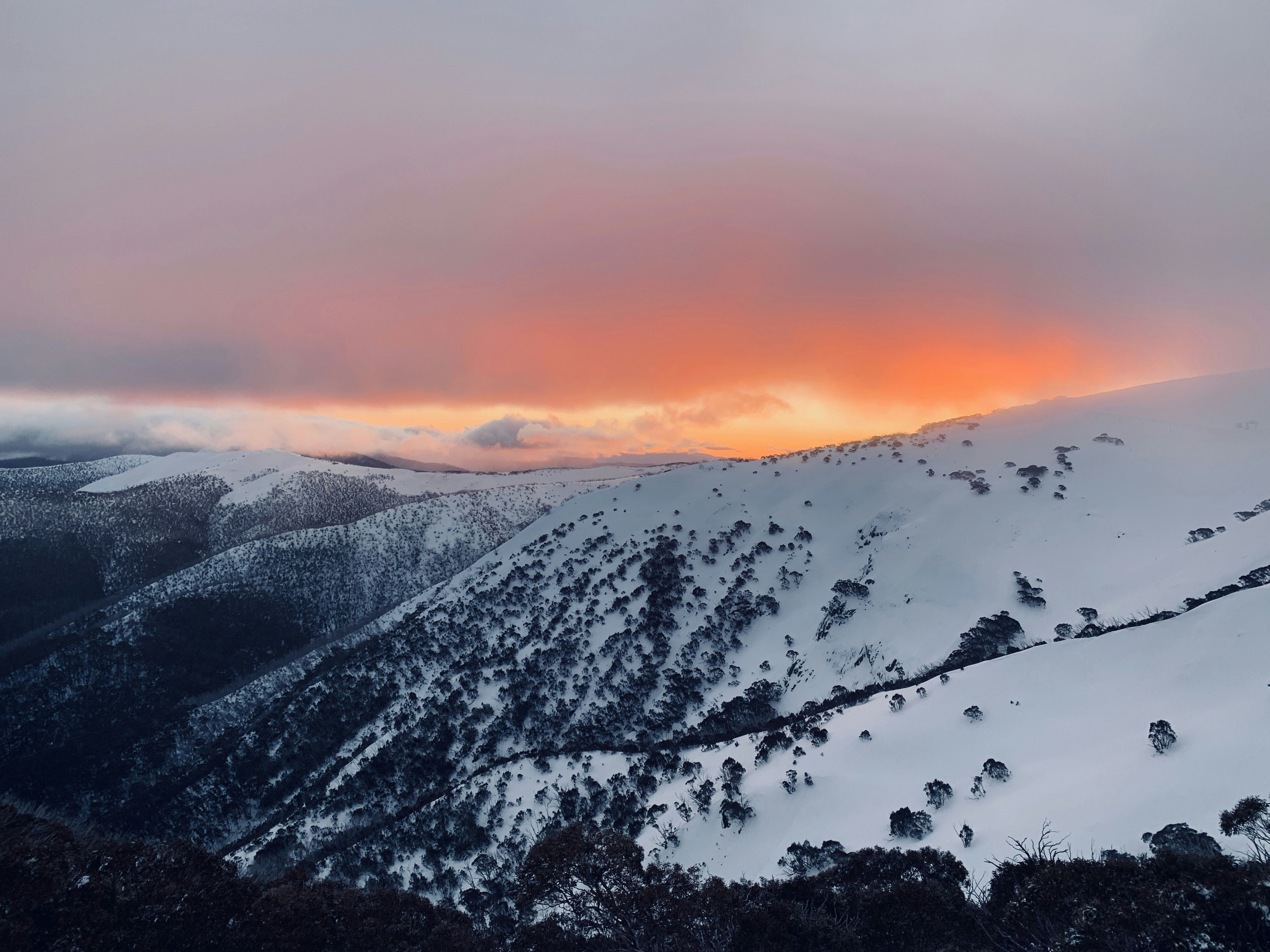Dawn’s Ember over Snow-Capped Ridges
