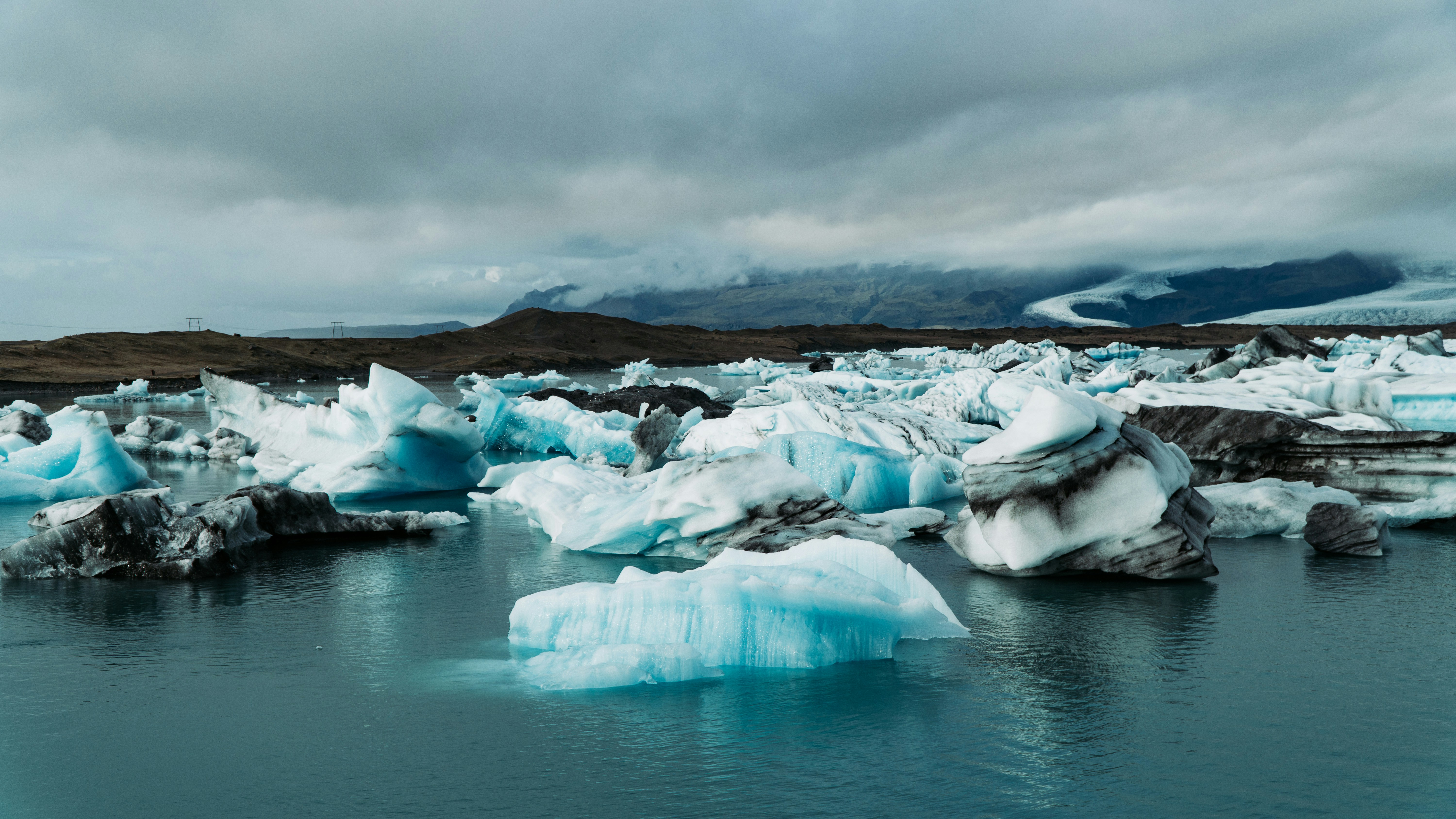 Ice on water near island photo – Free Iceland Image on Unsplash