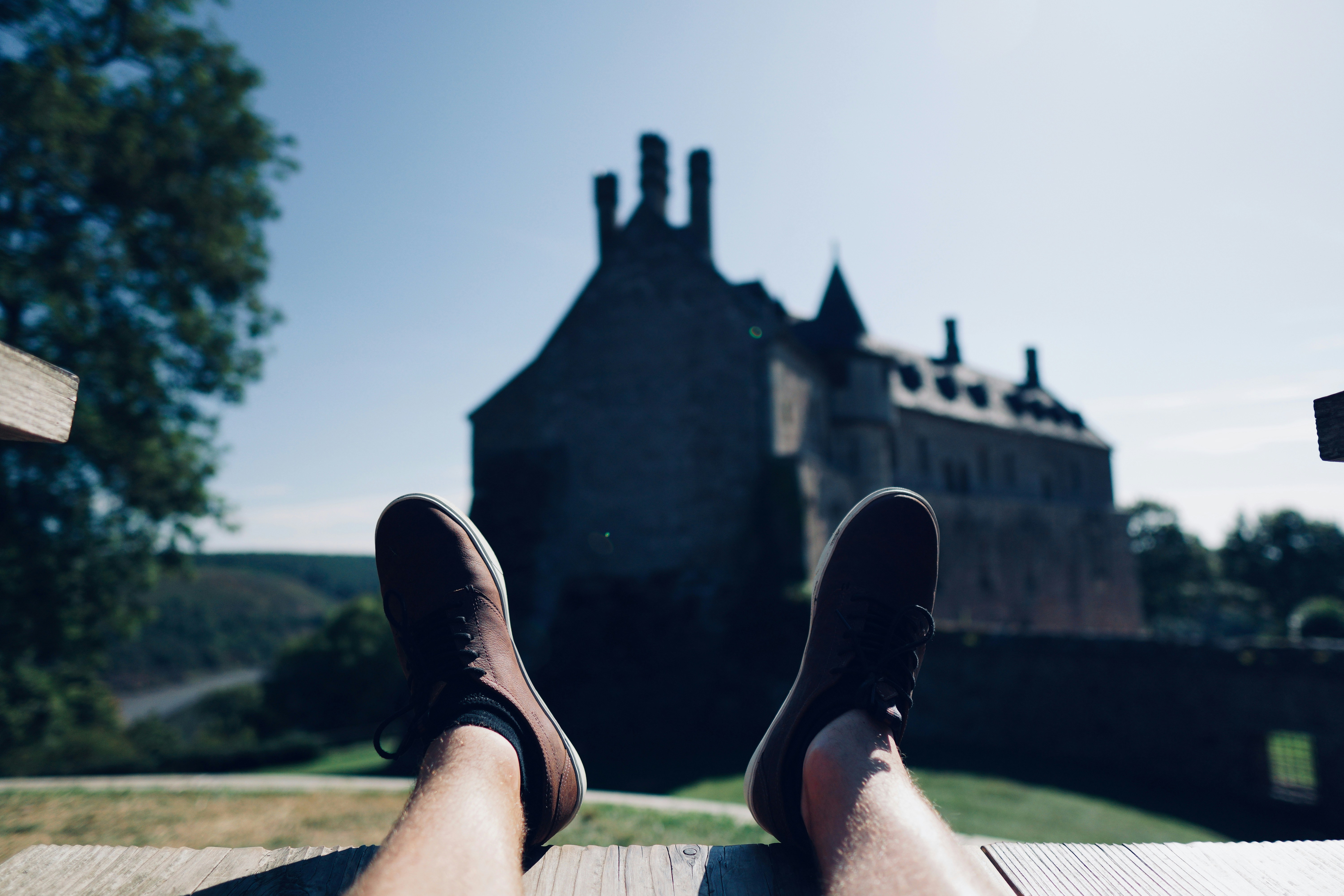 Feet Over Ramparts: A Leisure Moment Beside the Ancient Keep