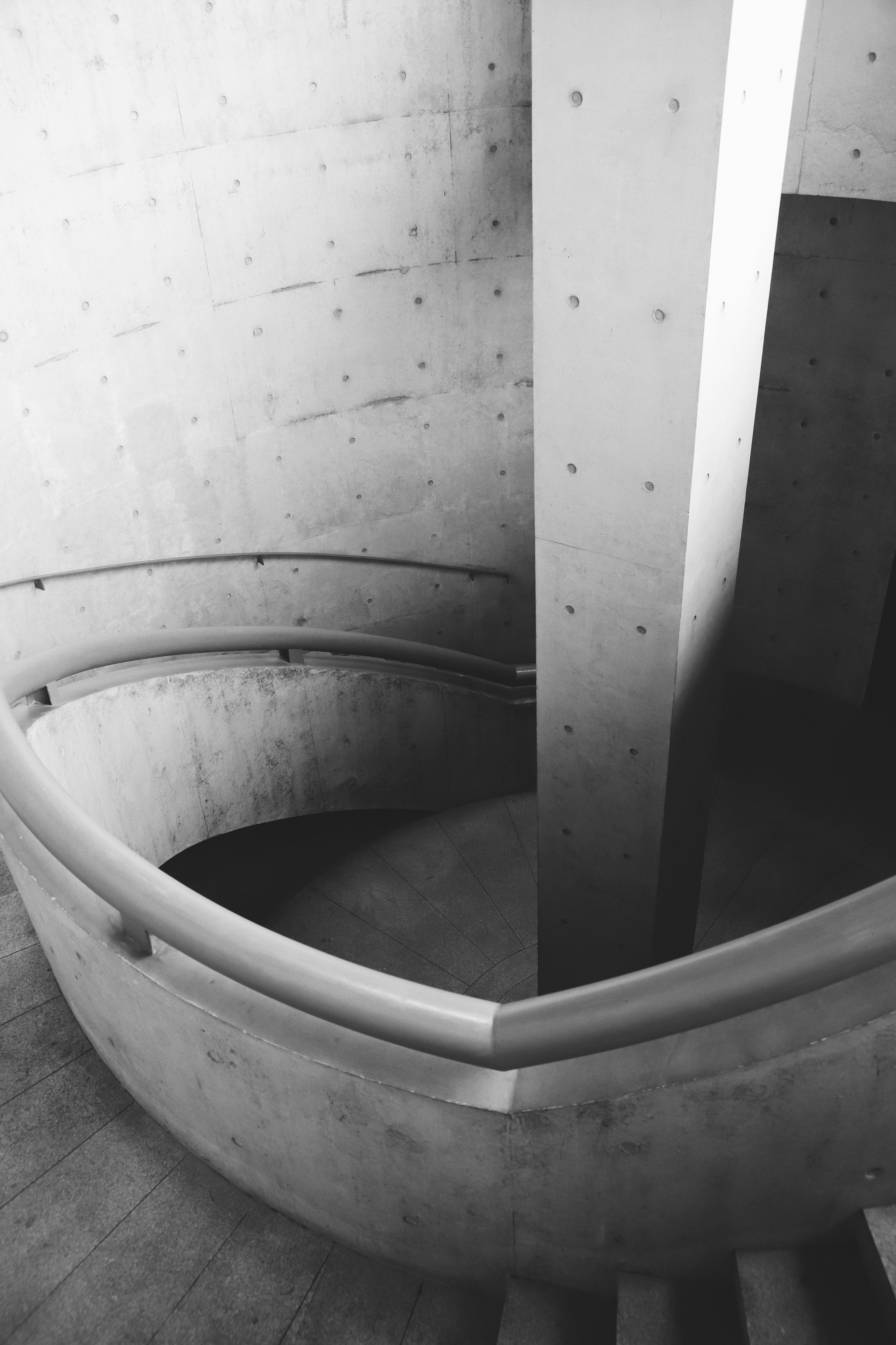 Concrete Spiral Whisper: Circular Atrium Monochrome