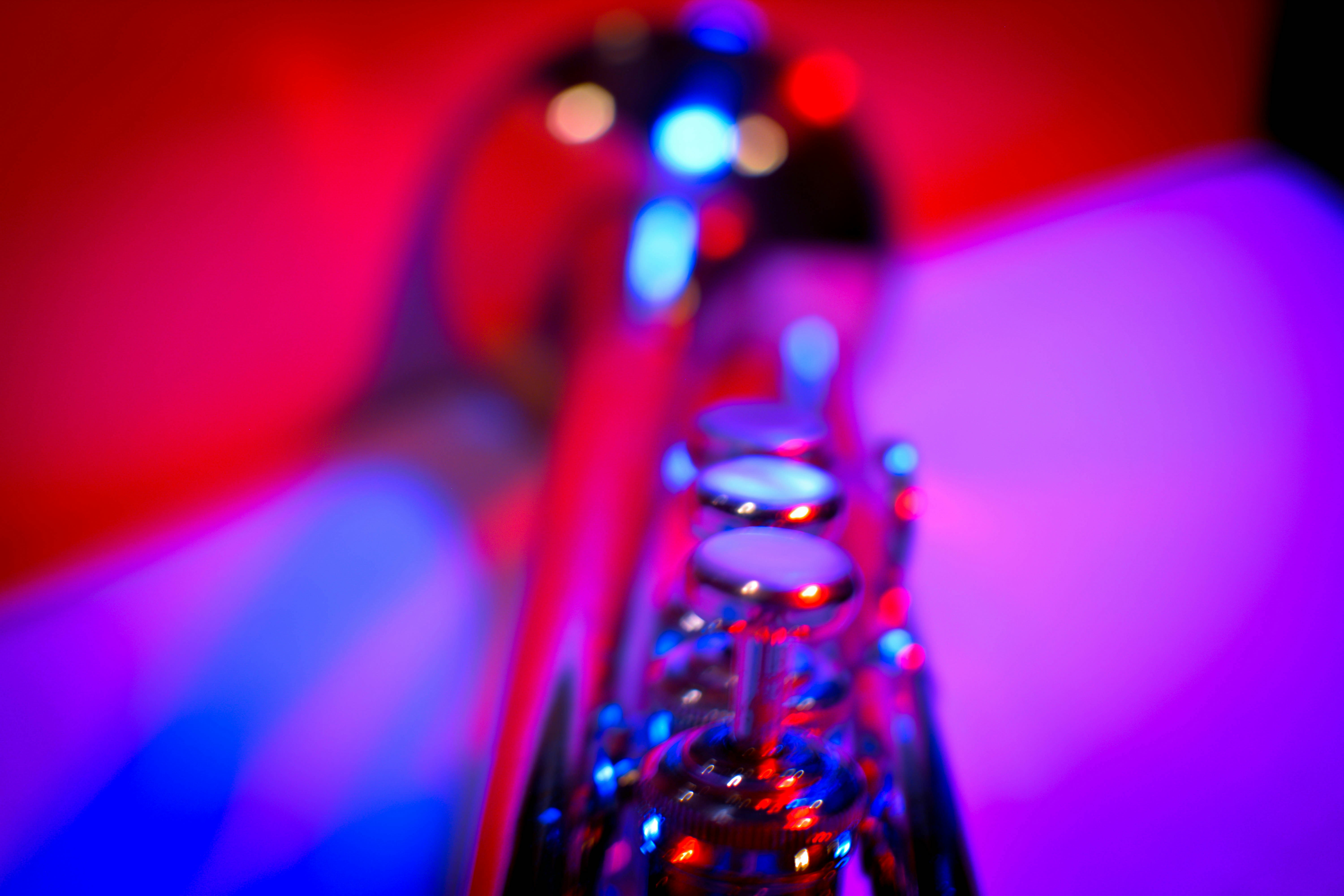Chromatic Droplets on a Neon-Illuminated Guitar Bridge